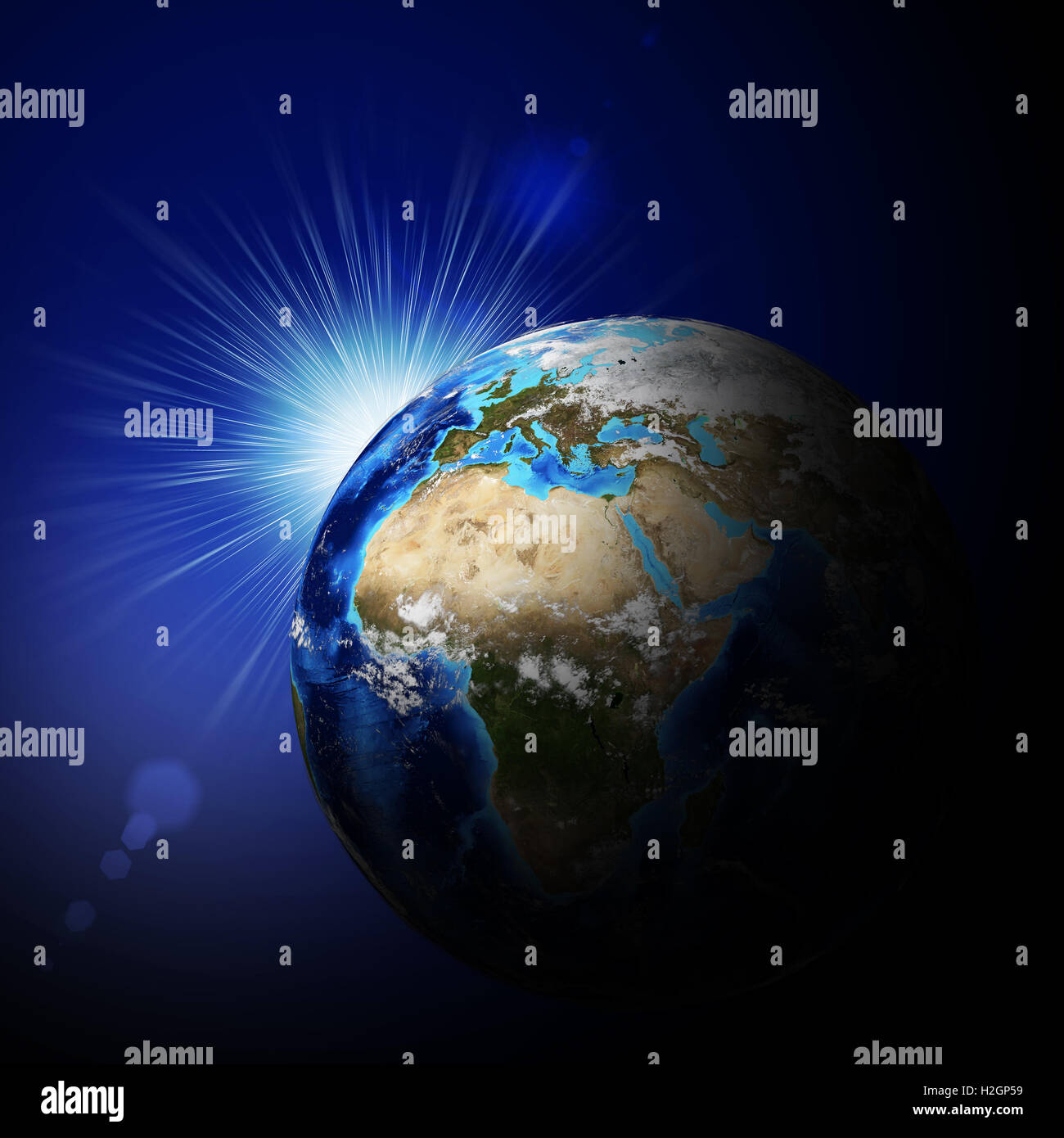 Earth planet in sun rays Stock Photo - Alamy