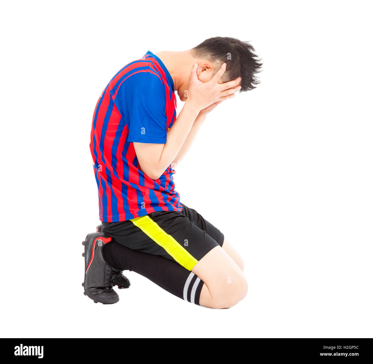 Agitated soccer player kneel down hi-res stock photography and images ...