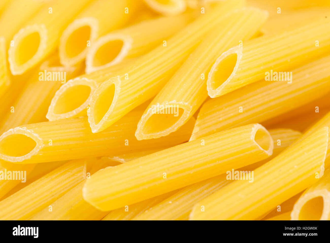 Italian Penne Rigate Macaroni Pasta raw food background or texture ...