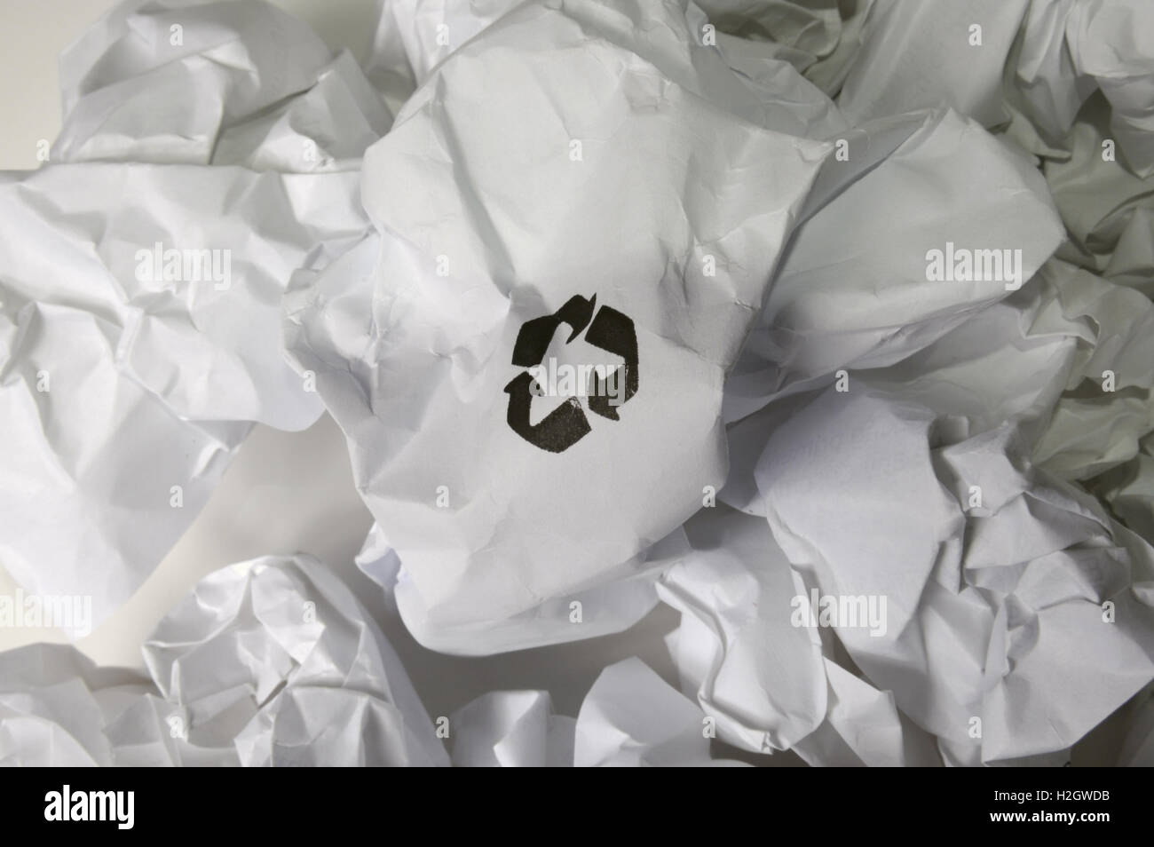 Screwed up Paper with Recycling Symbol Stock Photo - Alamy