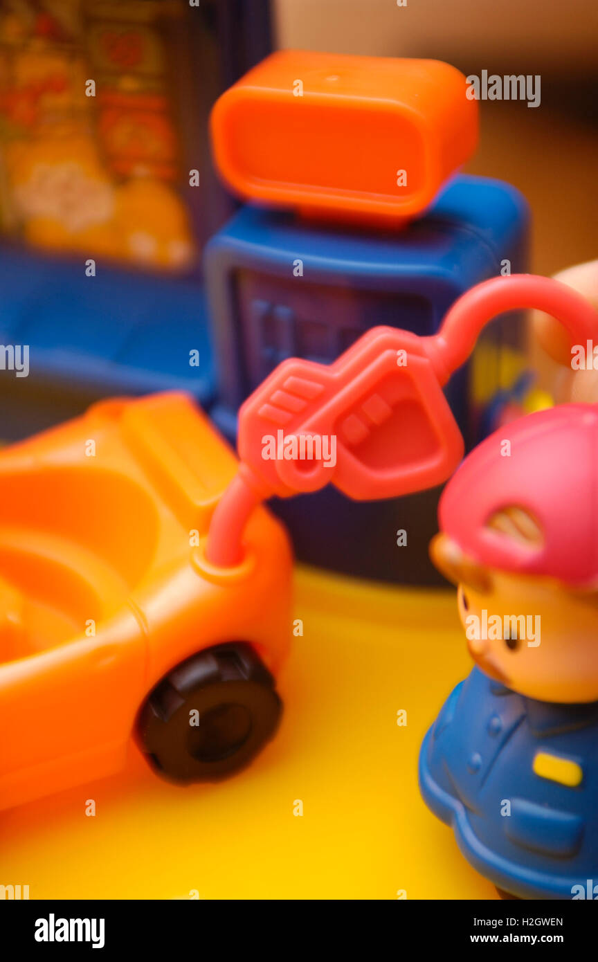 Toy Man Filling Car with Petrol Stock Photo - Alamy