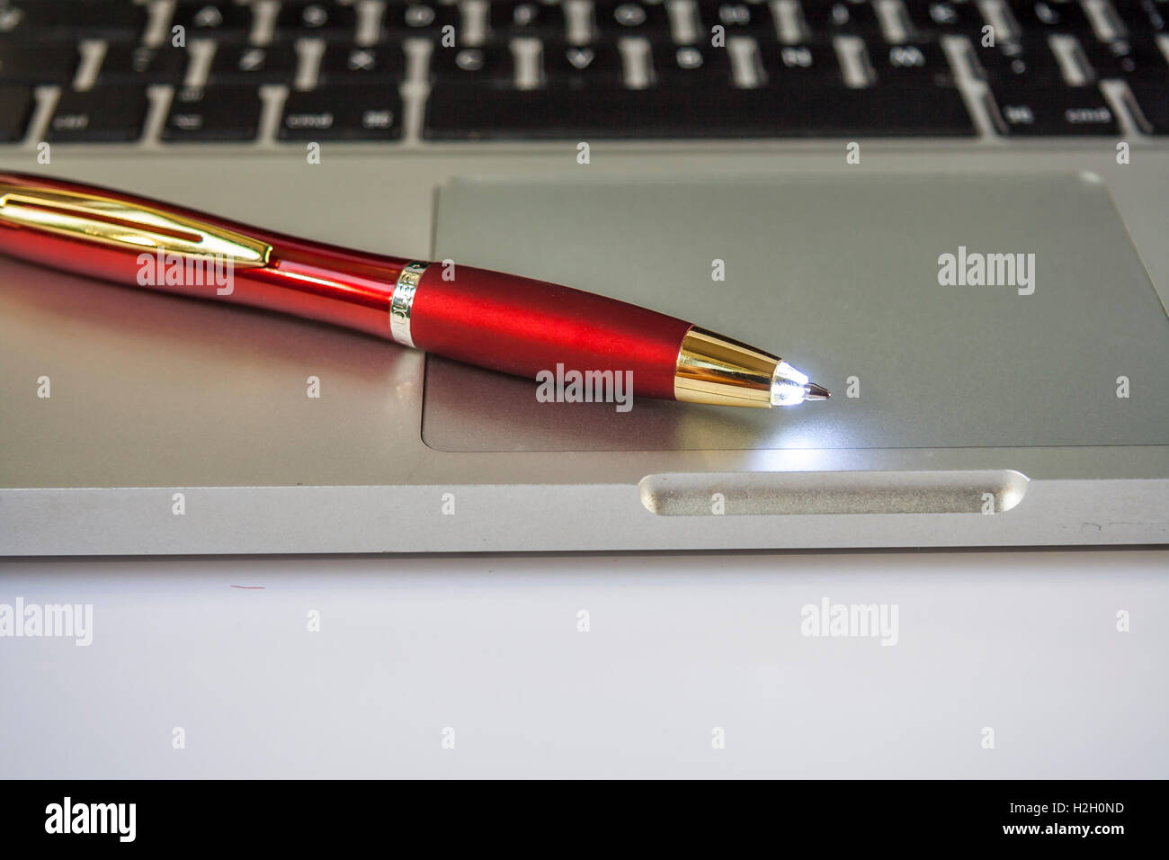 Pen And Laptop Stock Photo - Alamy