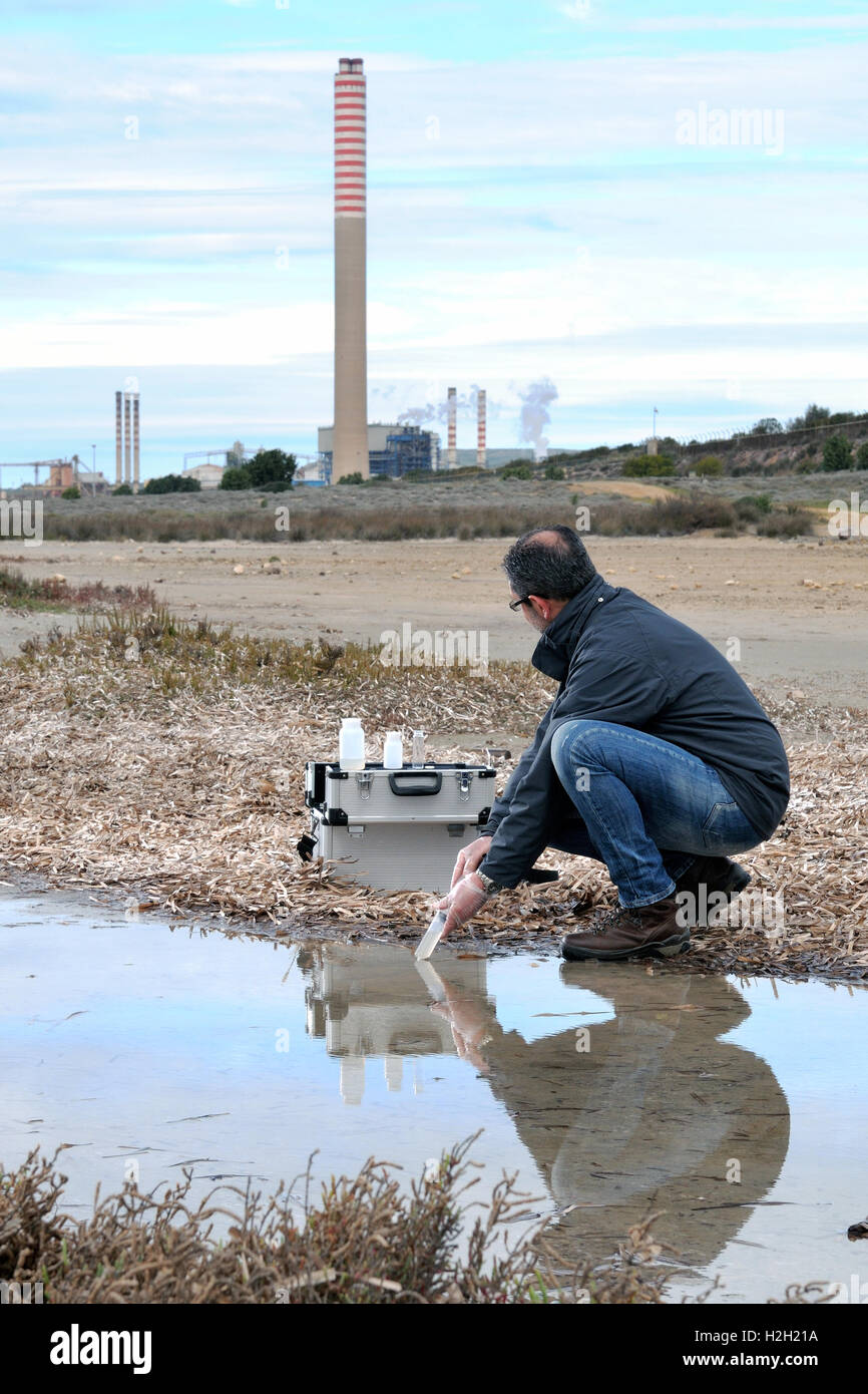 Collecting water samples for the analysis of its pollution near to an ...