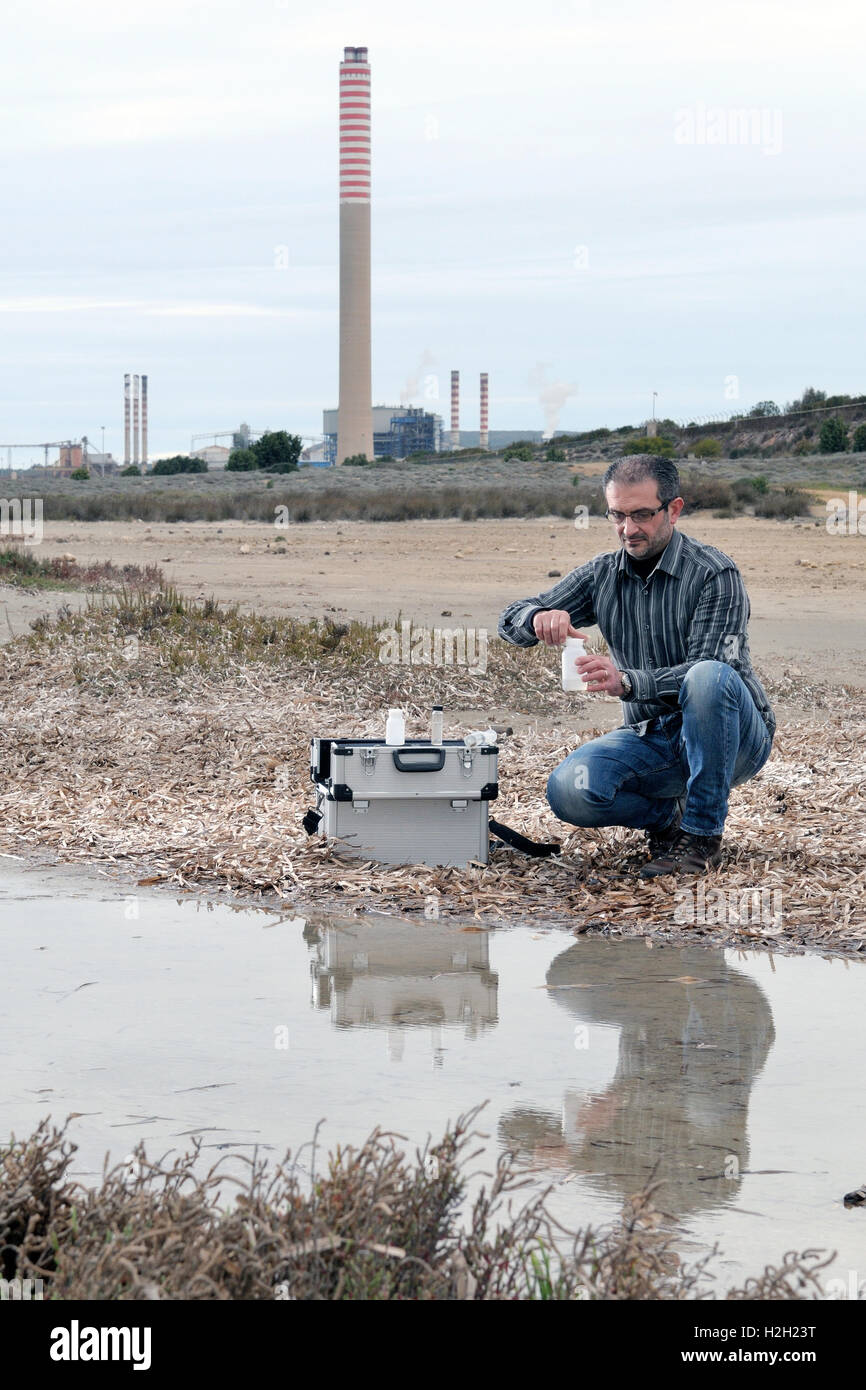 Collecting water samples for the analysis of its pollution near to an ...