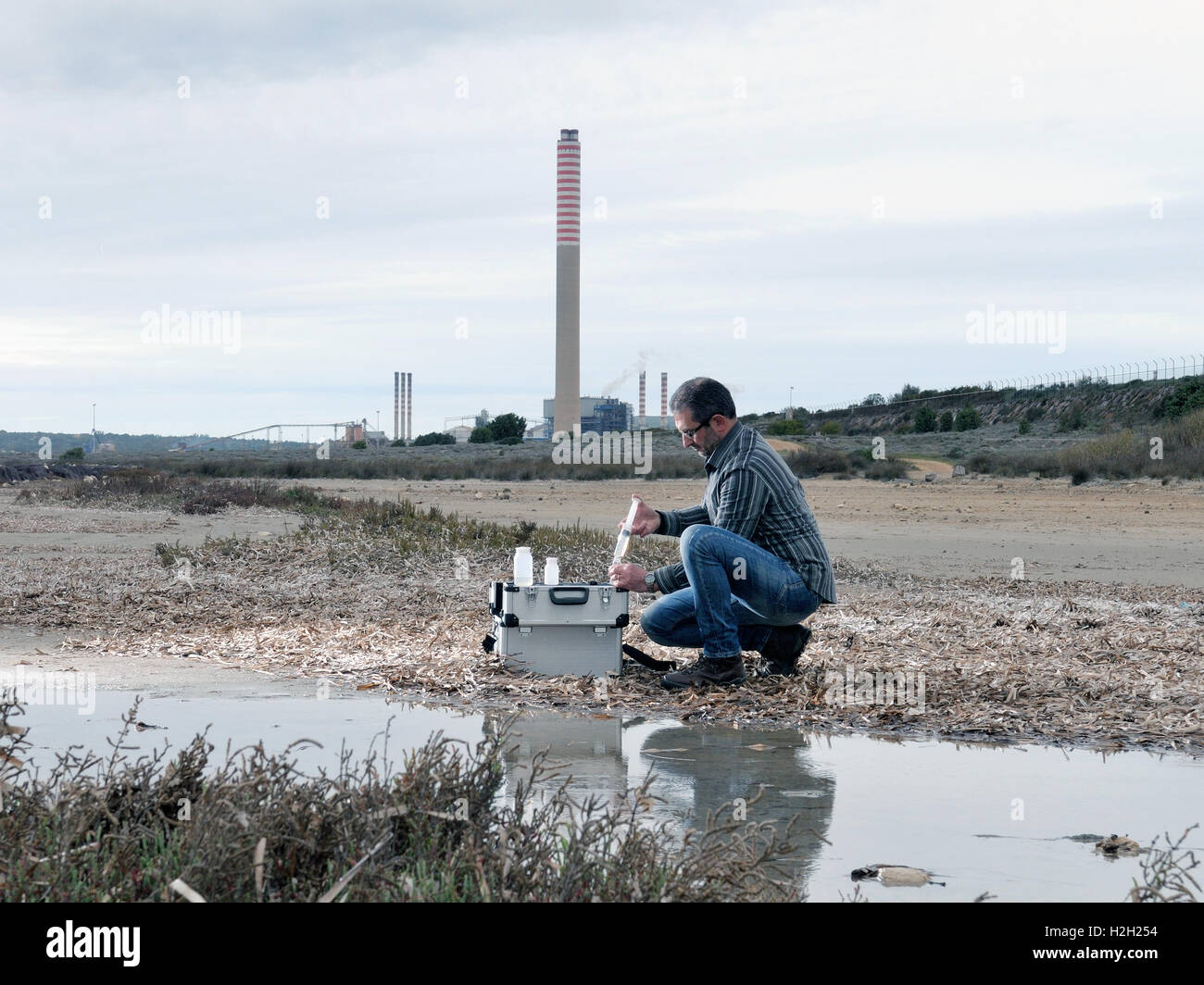 Collecting water samples for the analysis of its pollution near to an ...
