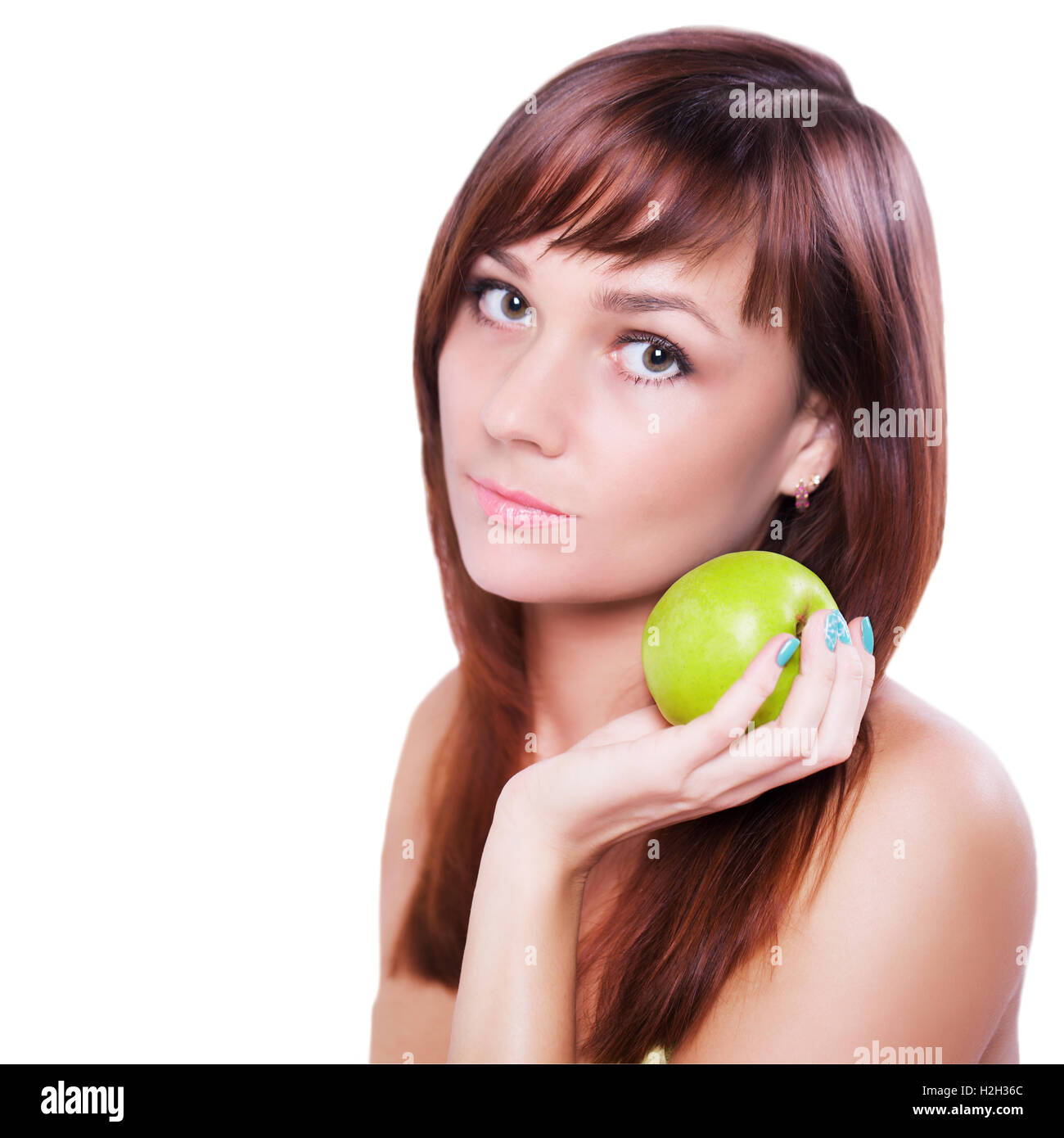 Young woman holding green apple - face close up Stock Photo - Alamy