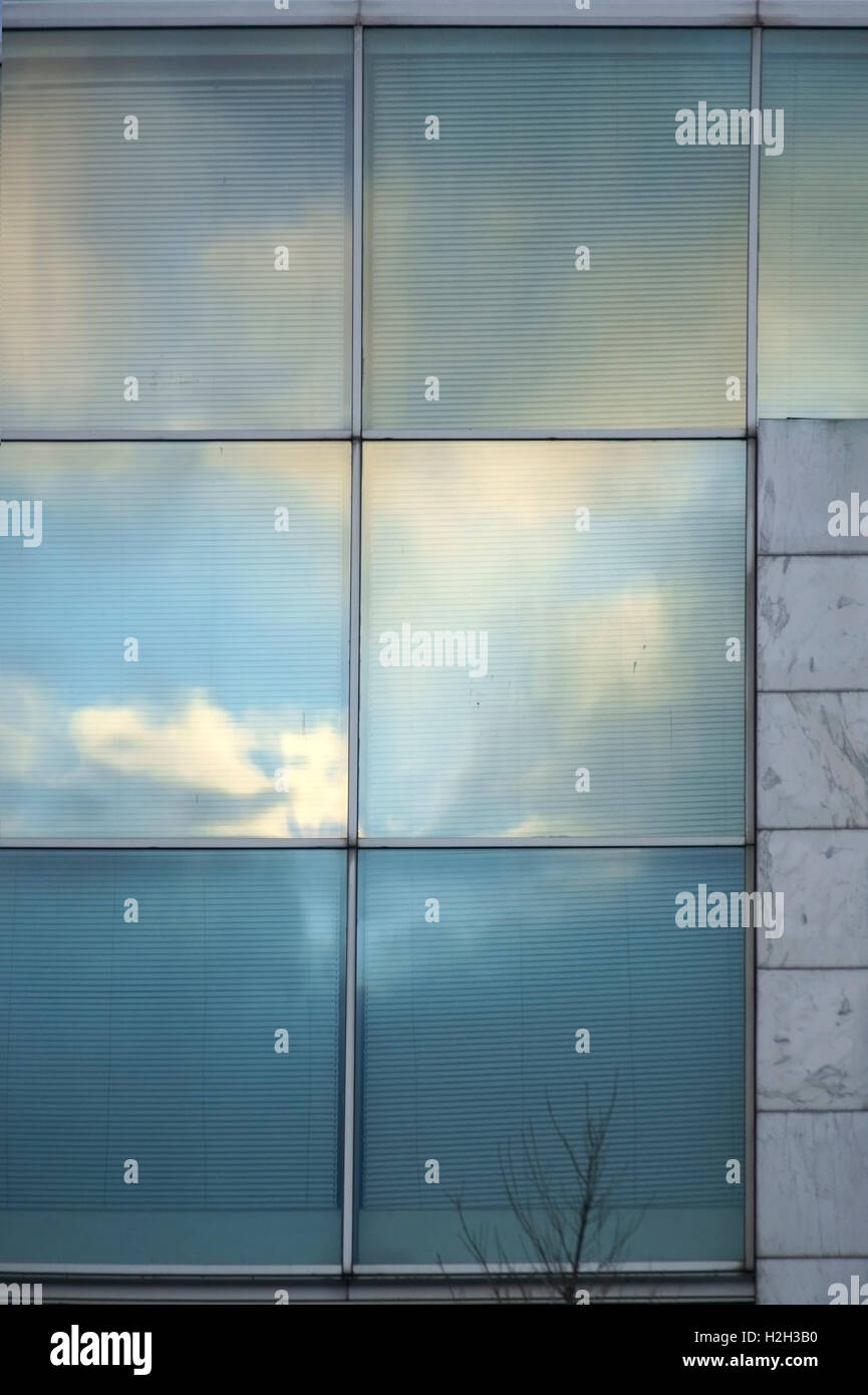 Cloud reflections in plastic windows Stock Photo - Alamy