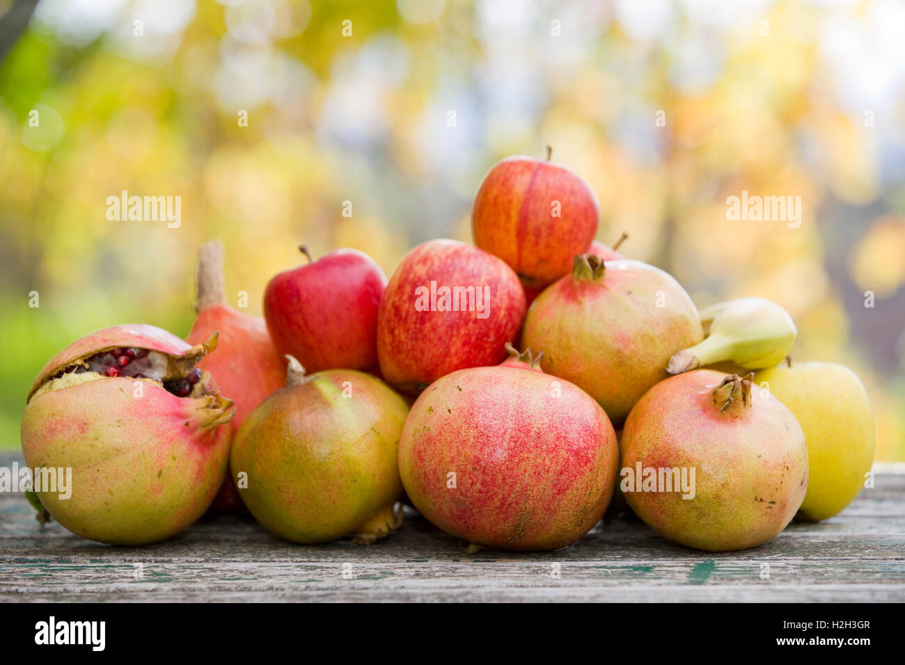 Fresh autumn fruits,on a wooden table Stock Photo - Alamy