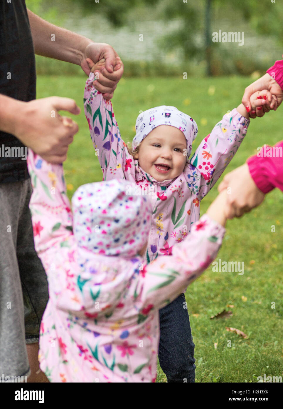 The two little baby girls playing in autumn park Stock Photo - Alamy