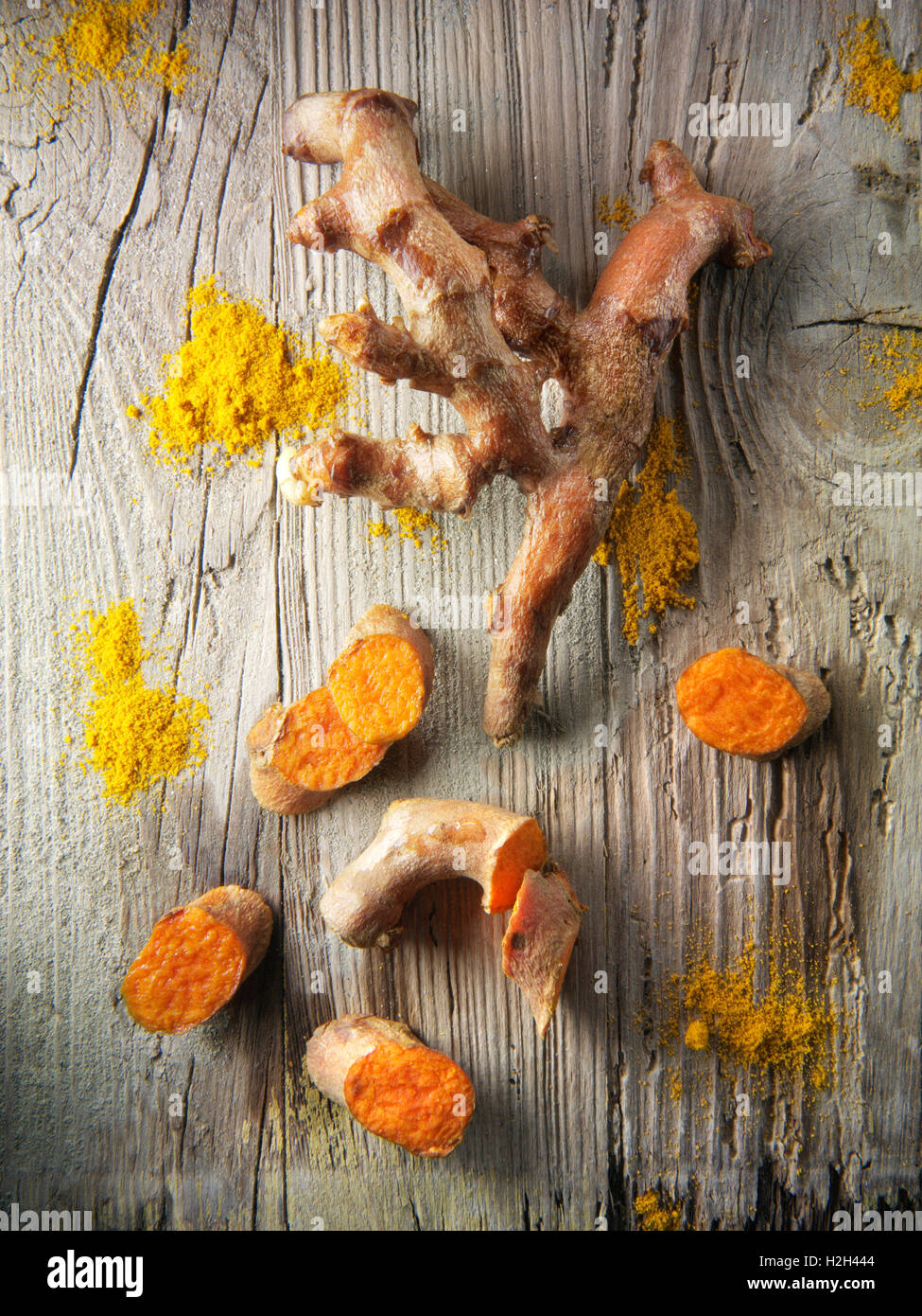 Fresh whole and cut turmeric or tumeric root (Curcuma longa Stock Photo ...