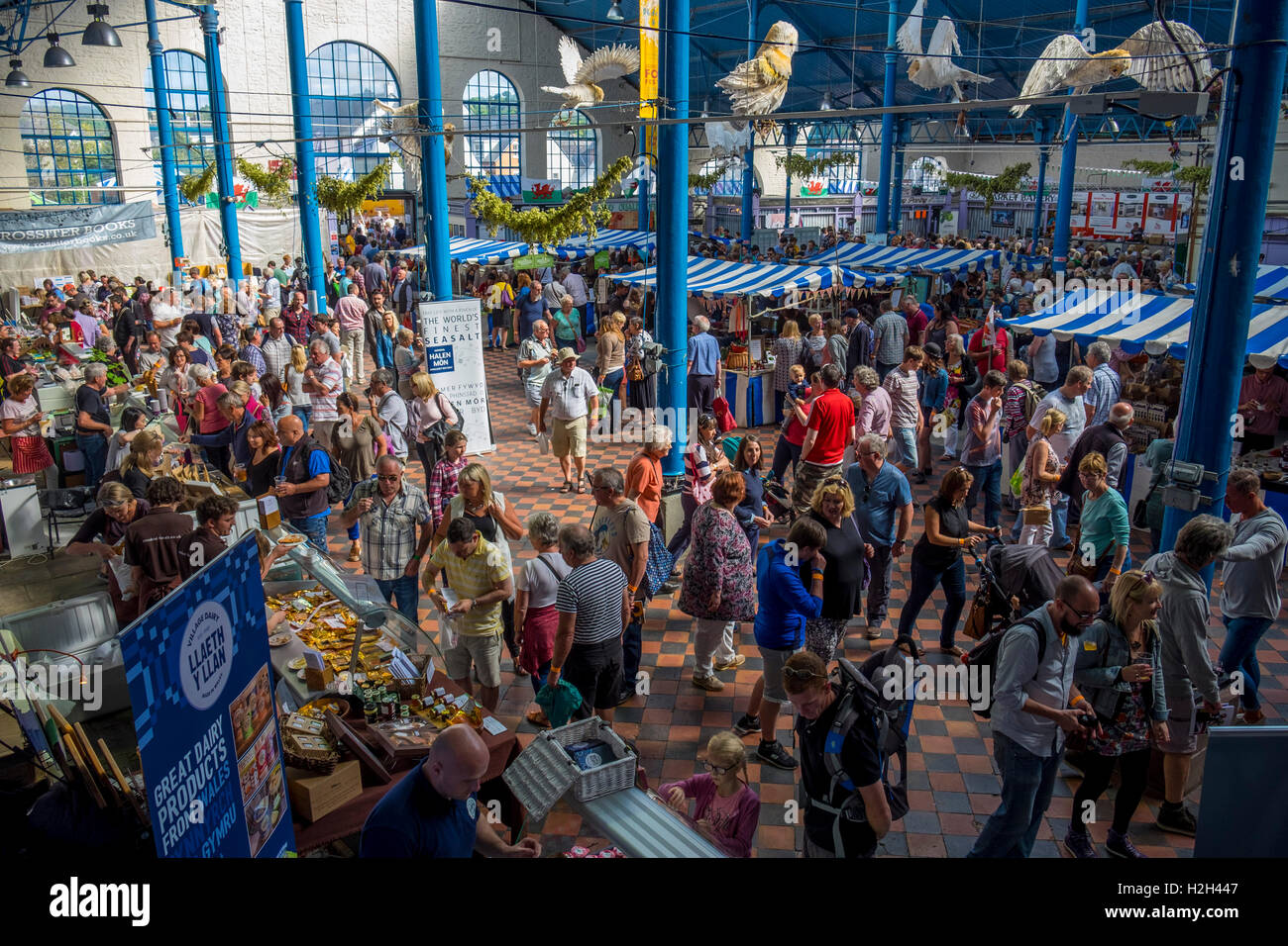 Visitors browsing food stalls,in the market hall, Abergavenny Food ...