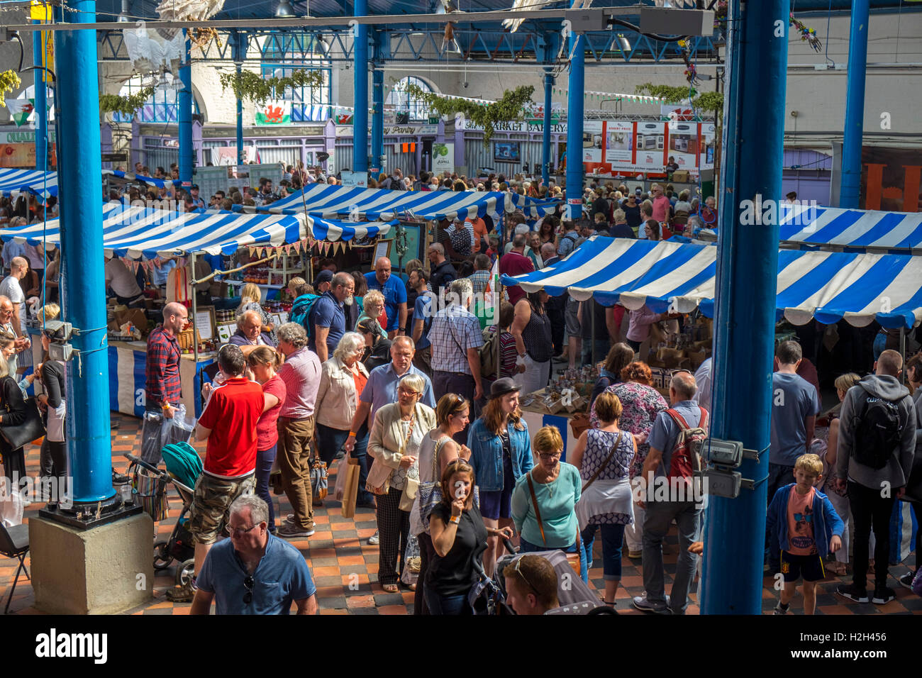 Visitors browsing food stalls,in the market hall, Abergavenny Food ...