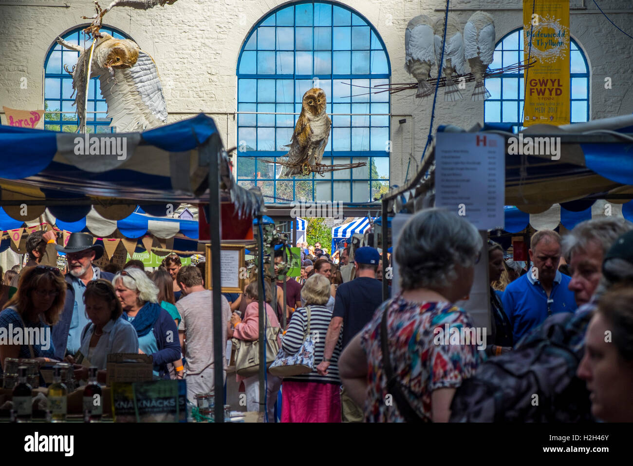 Visitors browsing food stalls,in the market hall, Abergavenny Food ...