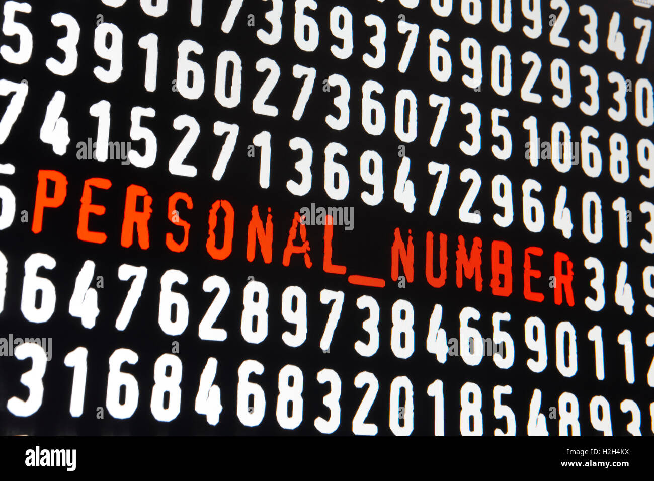 Computer screen with personal number text on black background ...