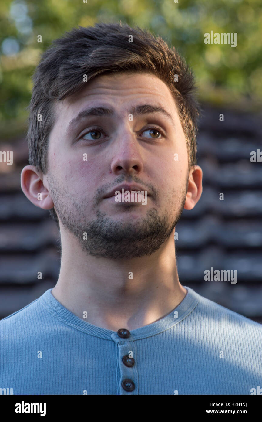 Young man in trees shadow Stock Photo - Alamy
