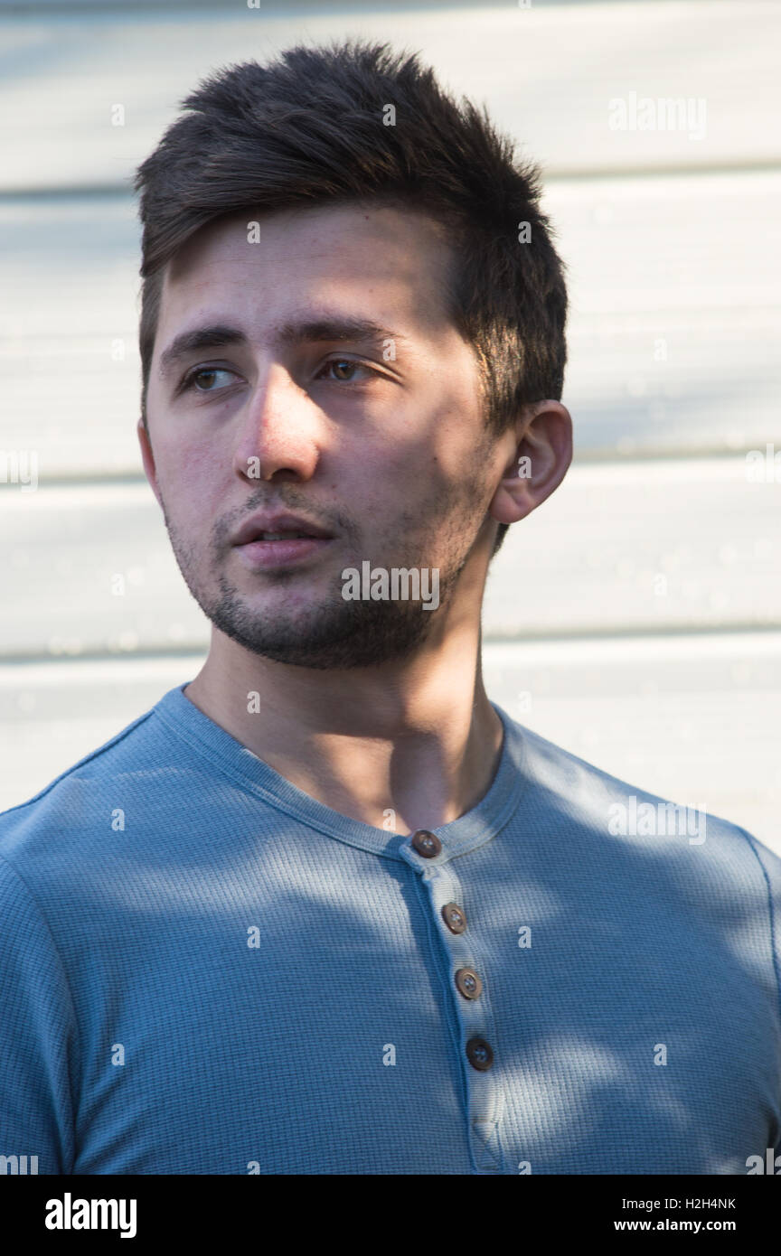 Young man in trees shadow Stock Photo - Alamy