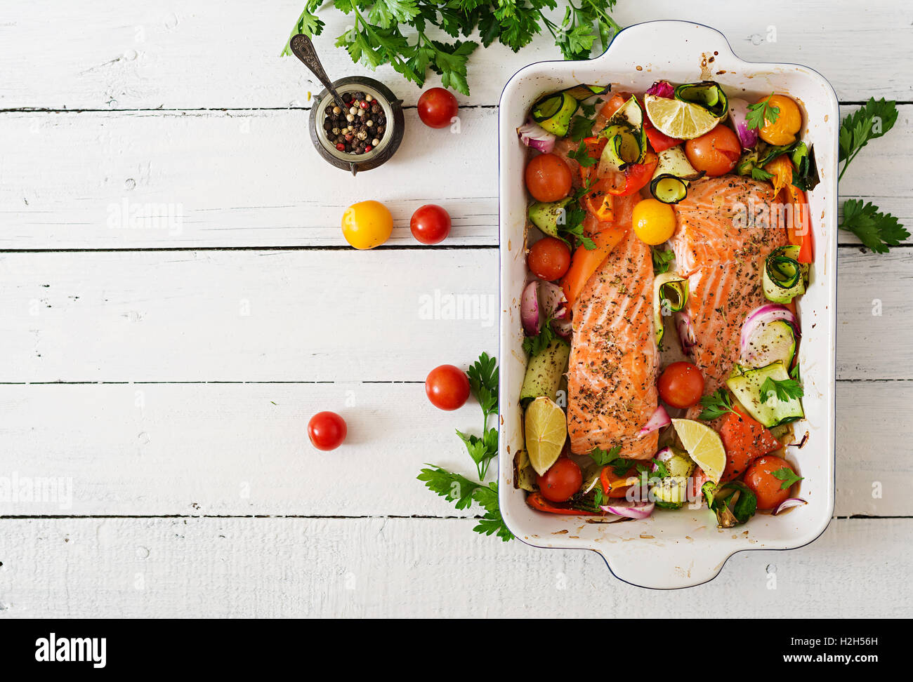 Baked salmon fillet with vegetables. Top view Stock Photo - Alamy