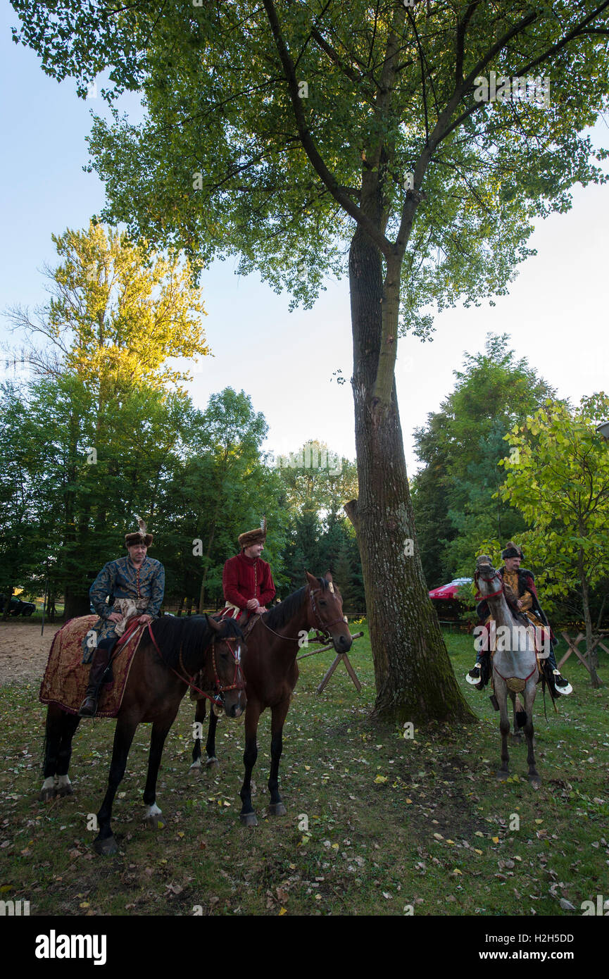 Horse riders in historical costumes during an open-air event in Pultusk ...