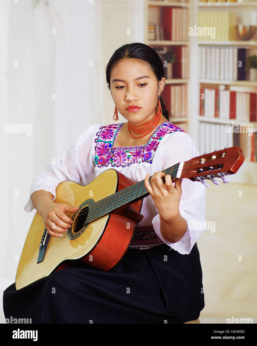 Portrait of young pretty woman wearing beautiful traditional andean ...