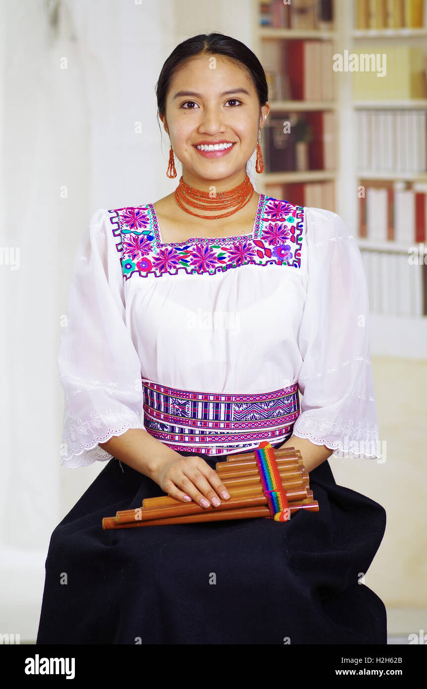 Portrait of young pretty woman wearing beautiful traditional andean ...