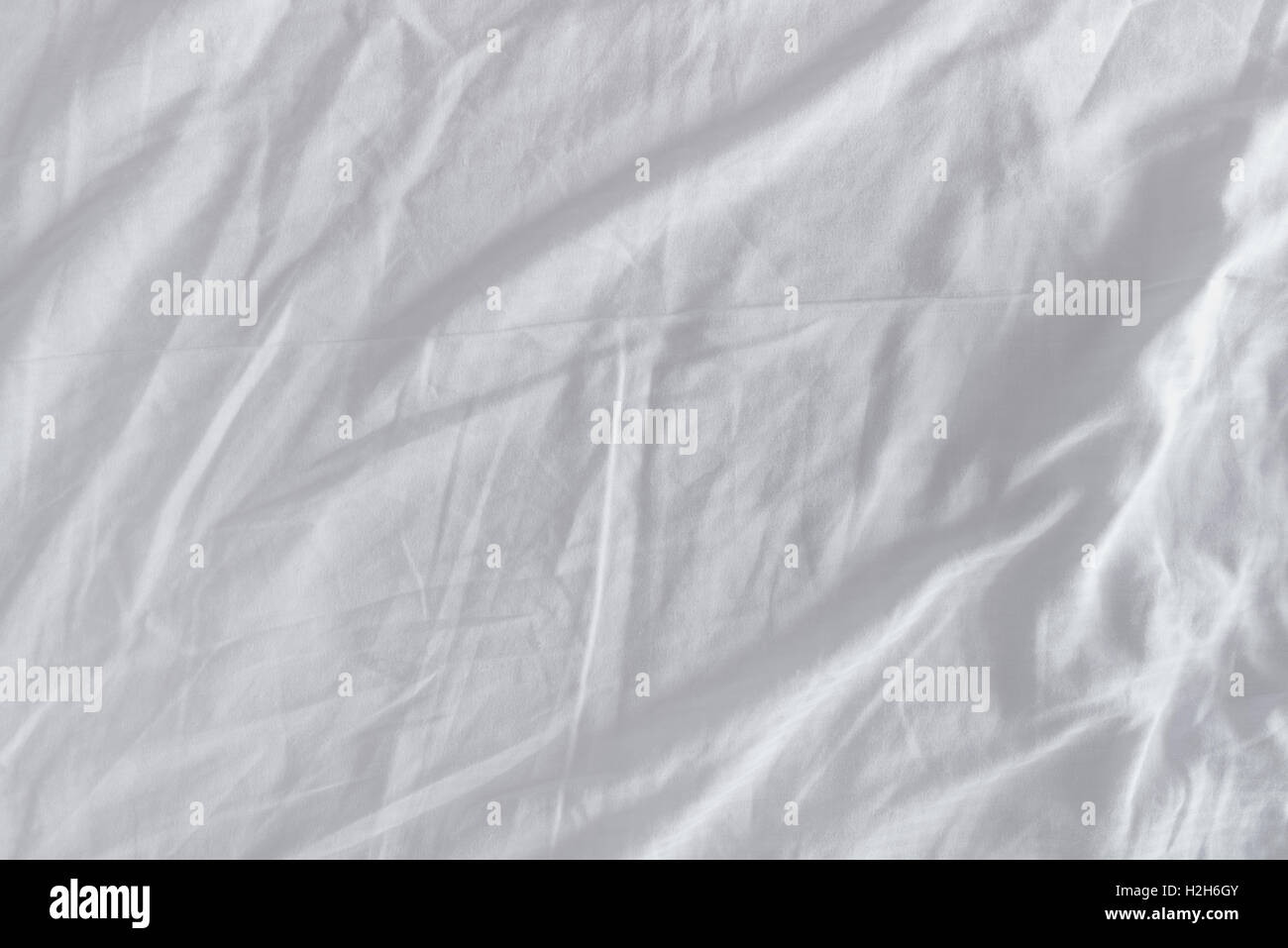 Messy bedding sheet after sleep, top view background Stock Photo - Alamy