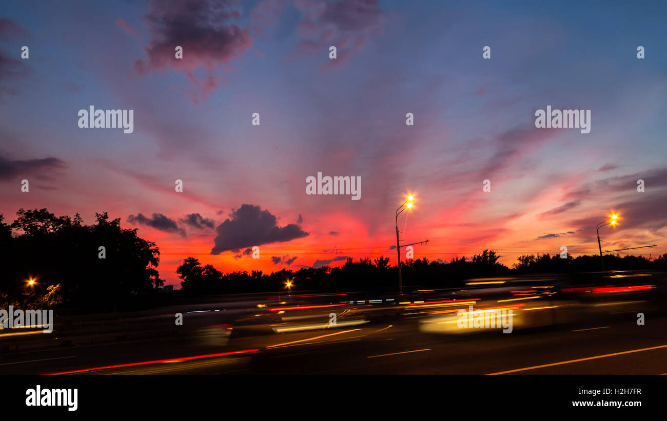 traffic on highway on sunset Stock Photo - Alamy