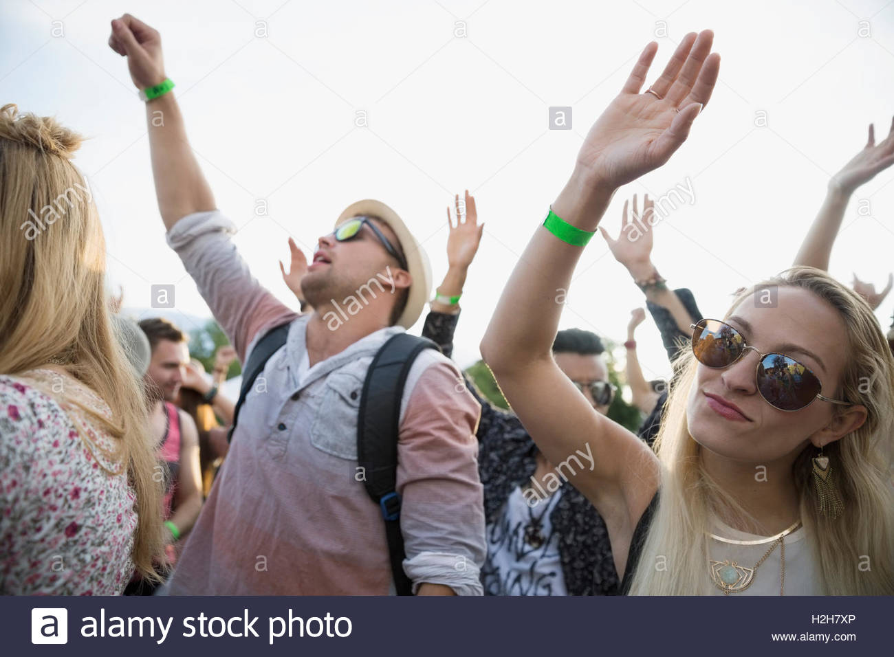 Young crowd cheering and dancing at summer music festival Stock Photo ...