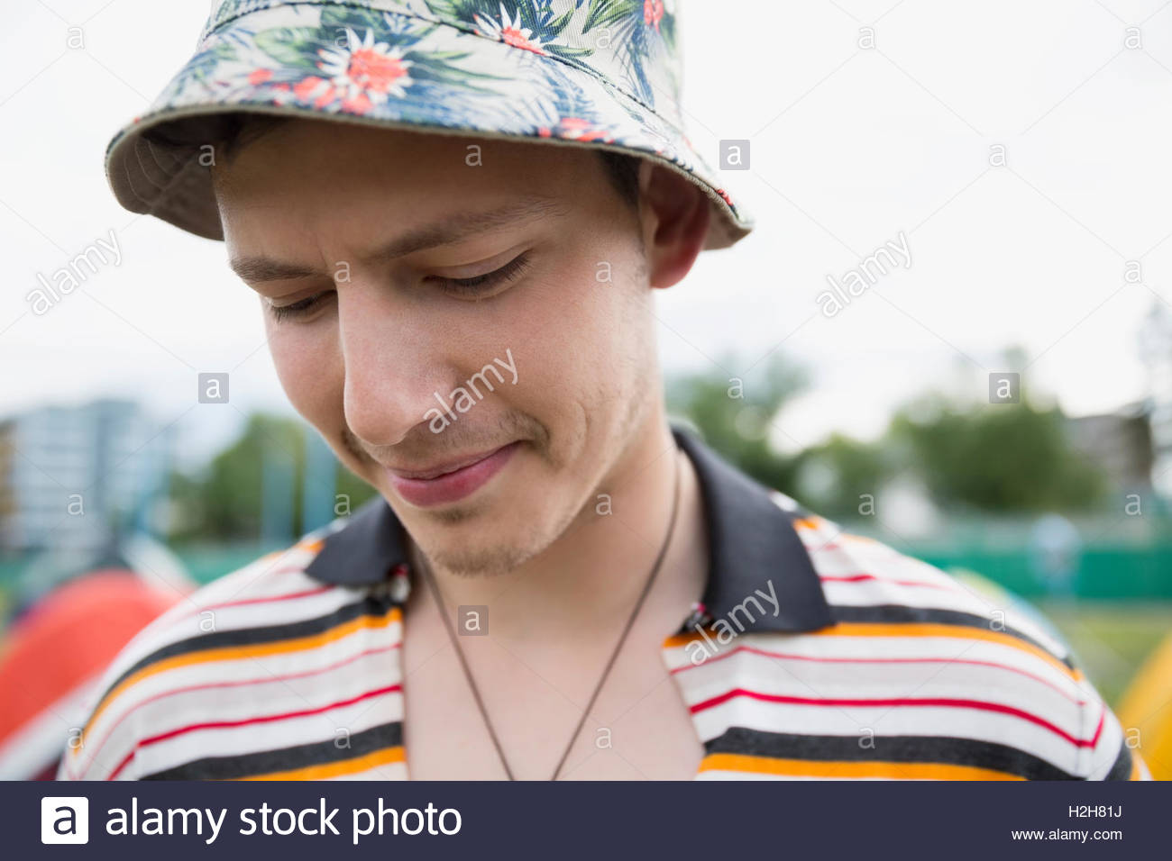 Man looking down with hat hi-res stock photography and images - Alamy