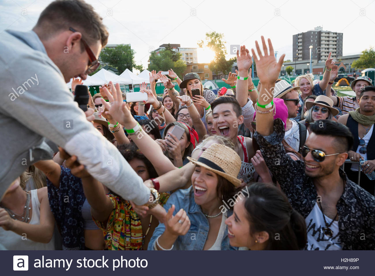 Crowd touching audience hi-res stock photography and images - Alamy