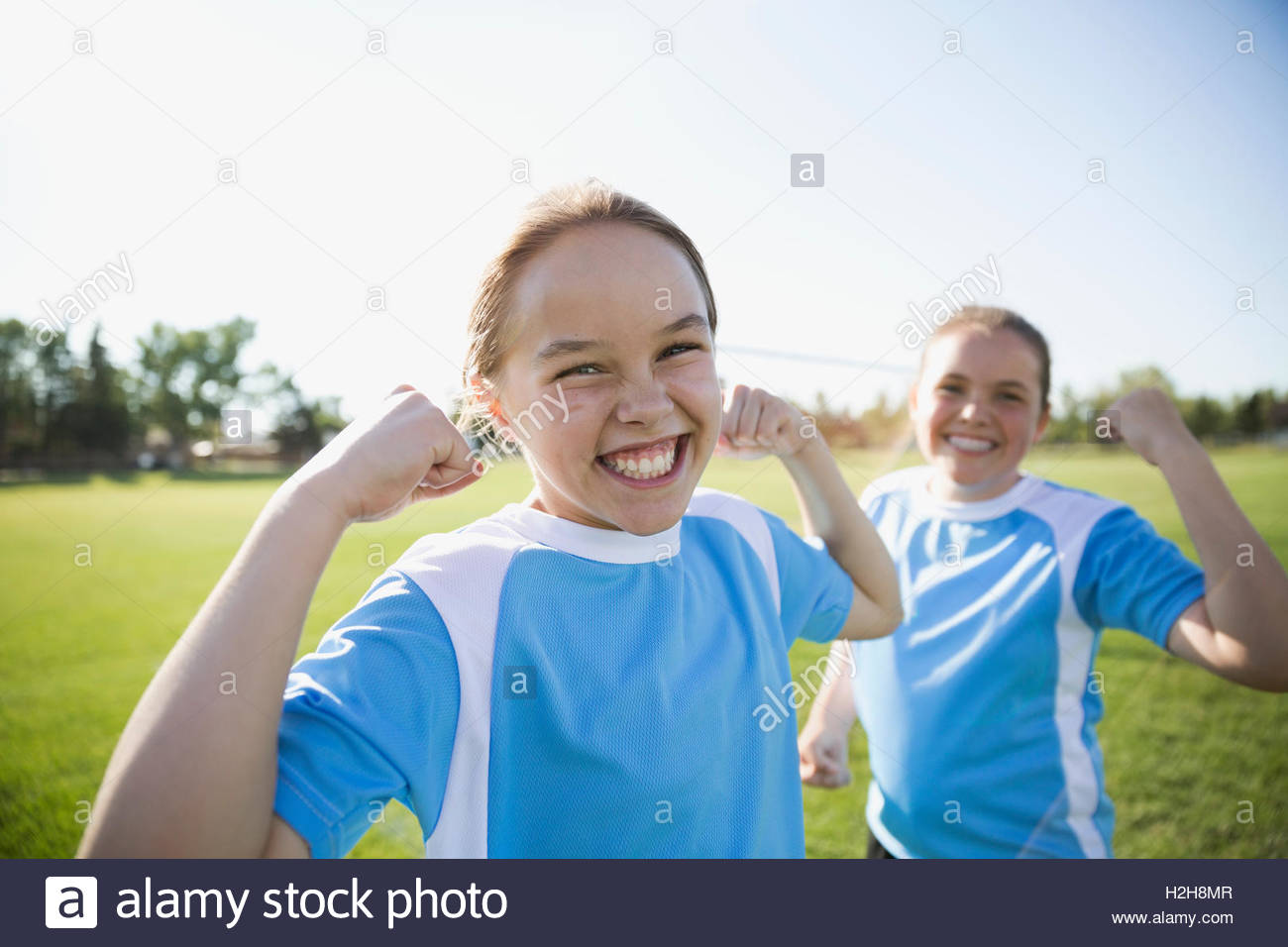 Girls flexing biceps High Resolution Stock Photography and Images - Alamy