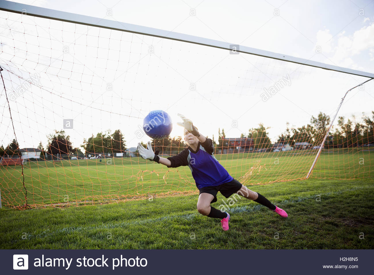 Goalie catching ball hi-res stock photography and images - Alamy