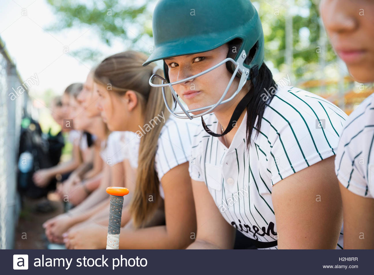 Portrait confident middle school girl softball player wearing batting ...