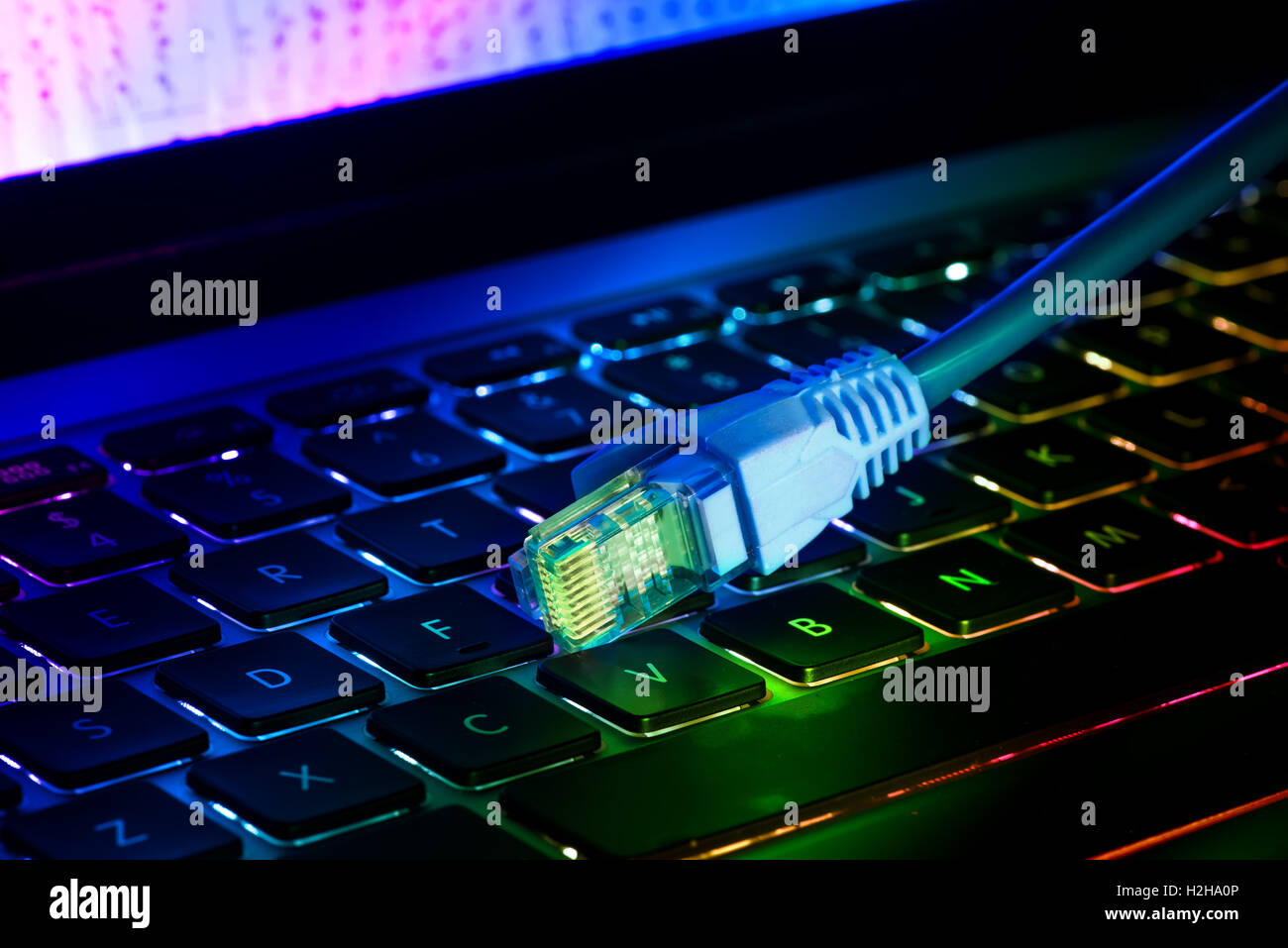 network cable with high tech technology color background Stock Photo ...