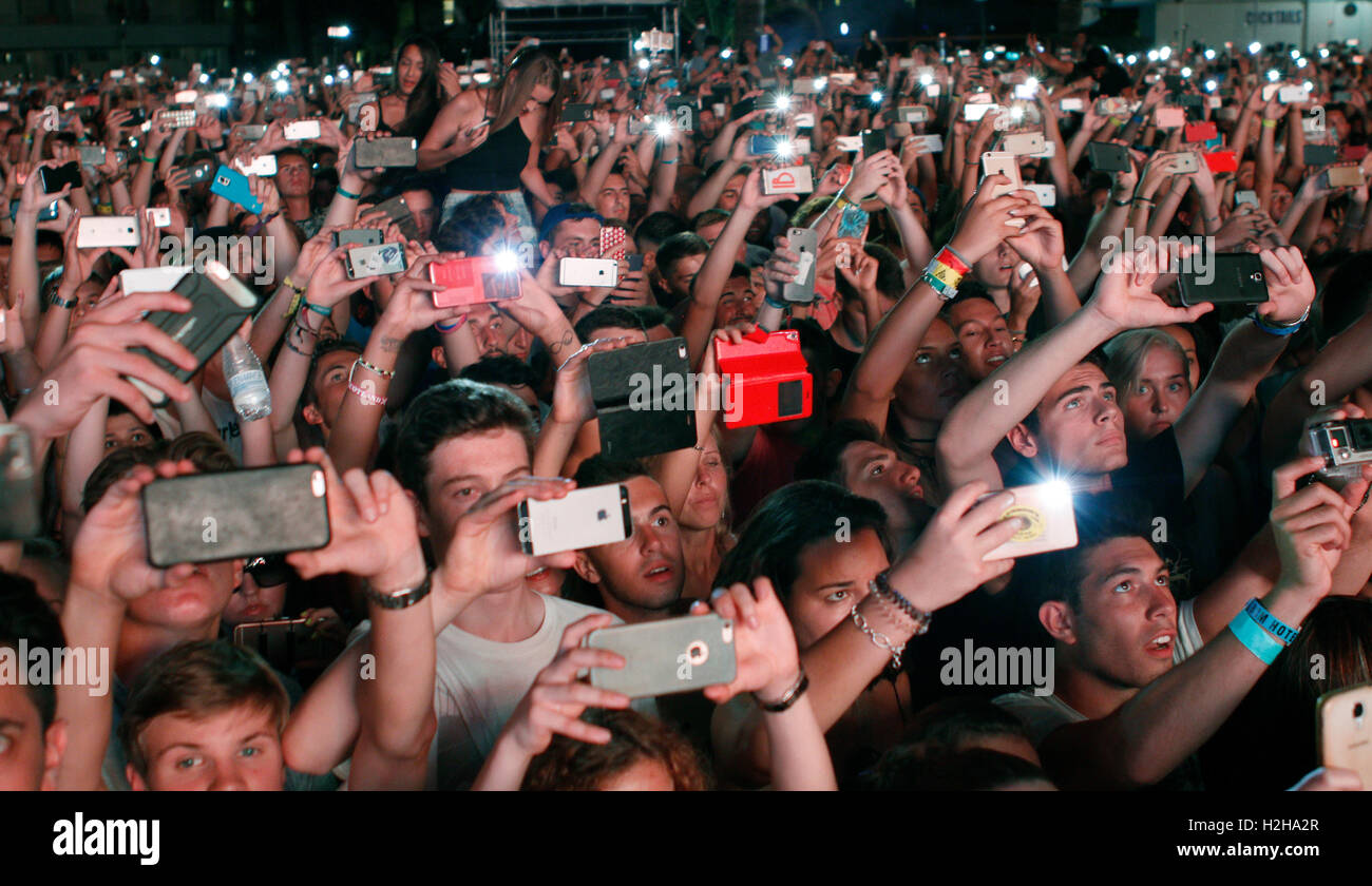 Crowd of people taking photos with the phone in a summer concert Stock ...