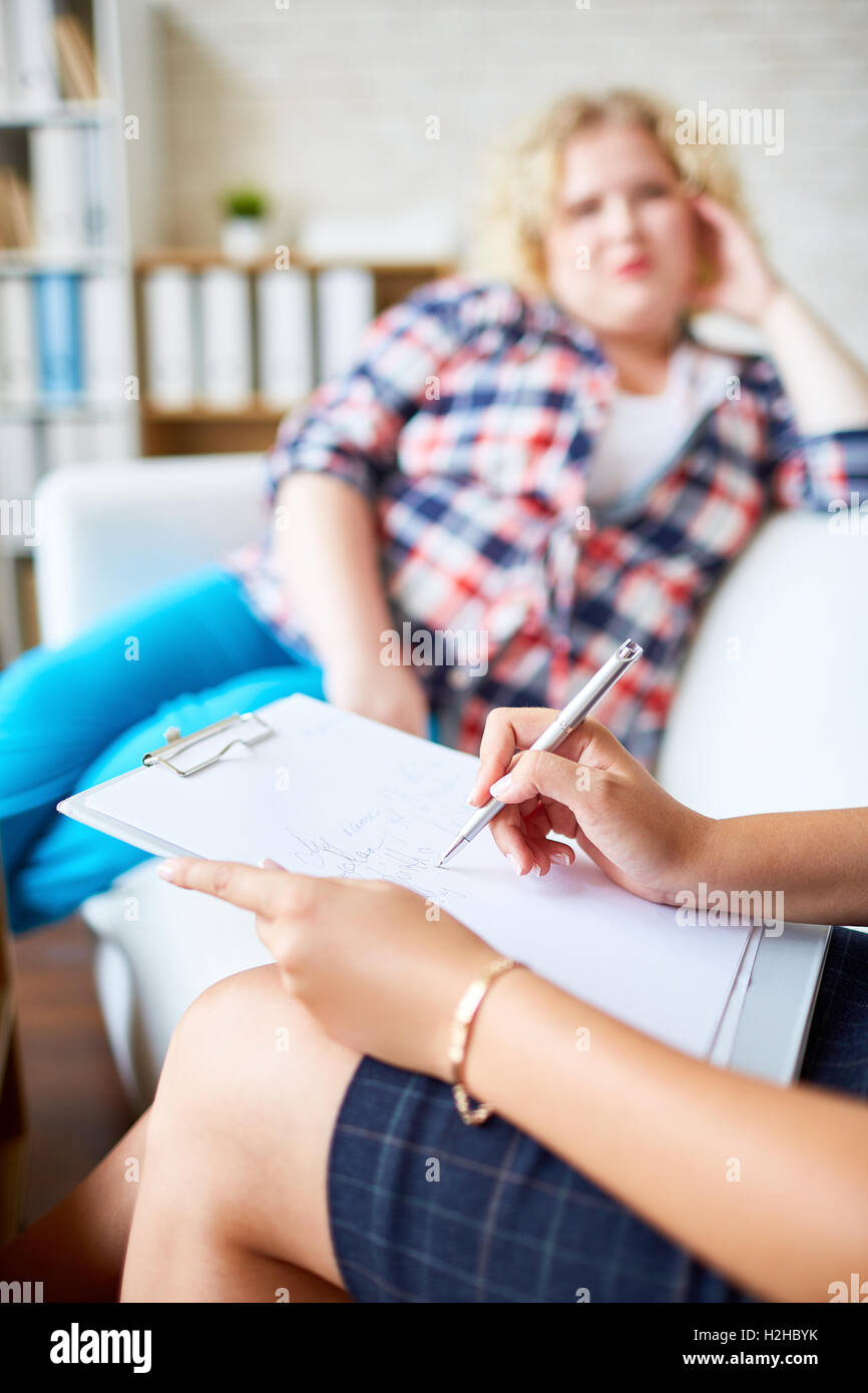 Human hands writing down psychological notes Stock Photo - Alamy