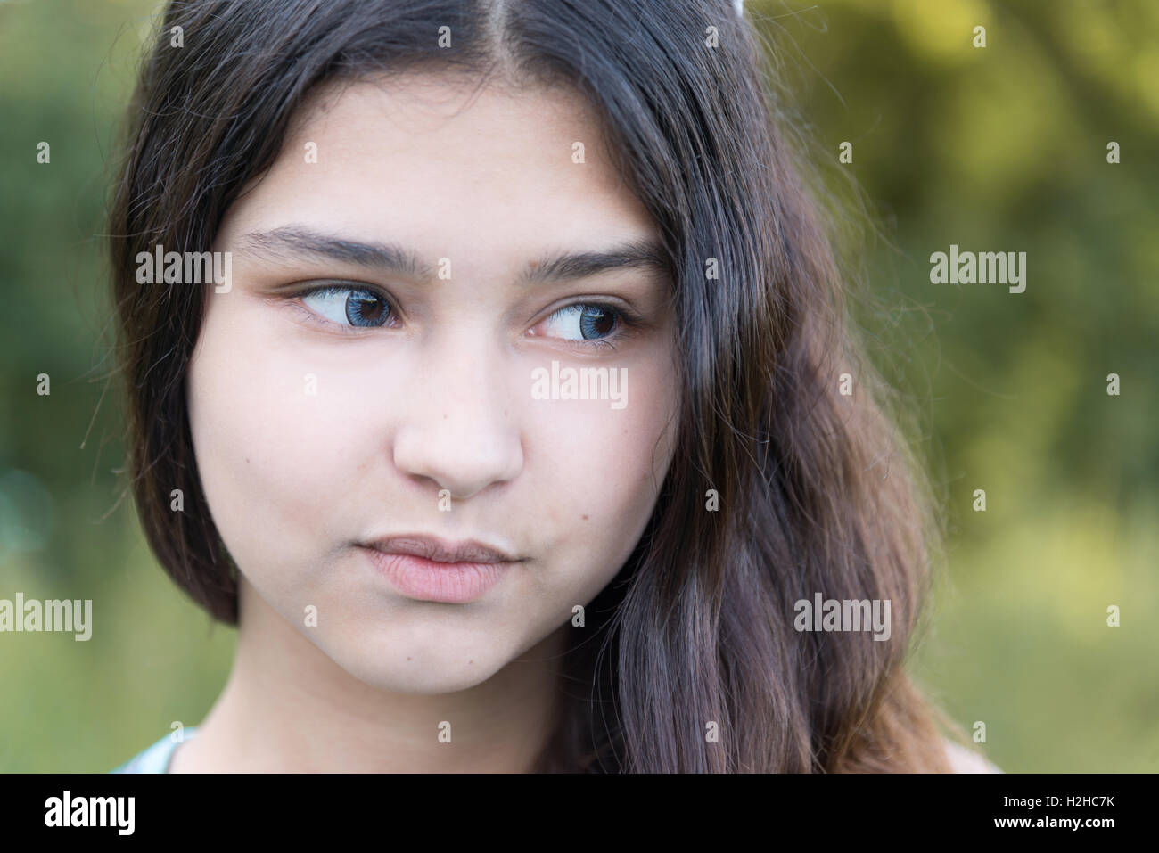 Portrait of beautiful girl looking to the side Stock Photo - Alamy