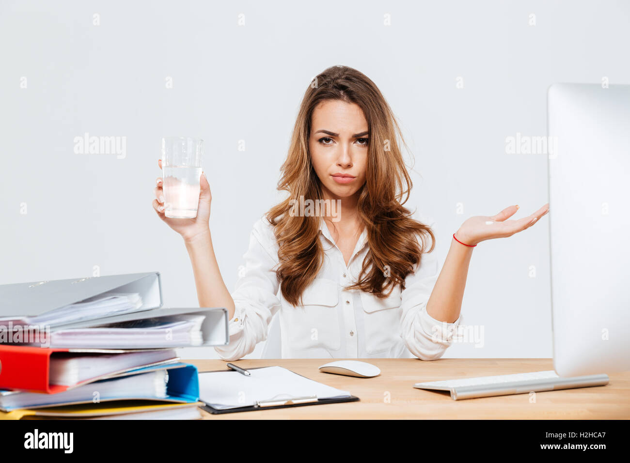 Frustrated disappointed businesswoman sitting at the dest at office ...