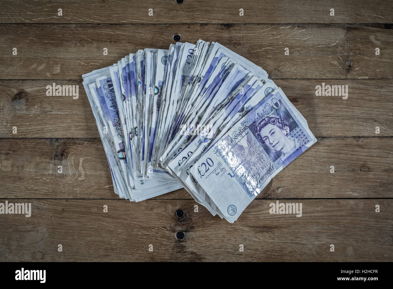 Pile pound notes hi-res stock photography and images - Alamy