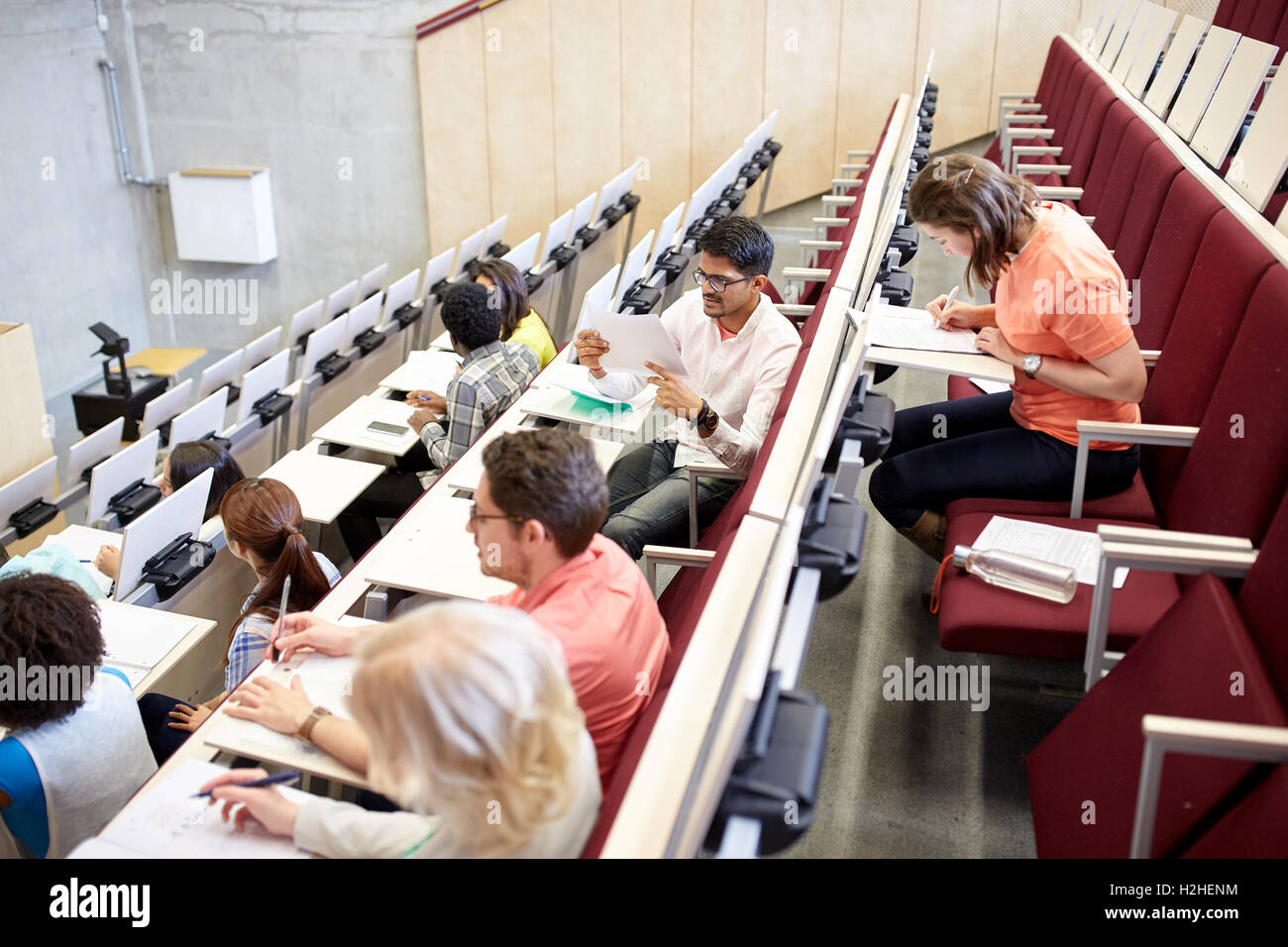 group of students writing test at lecture hall Stock Photo - Alamy