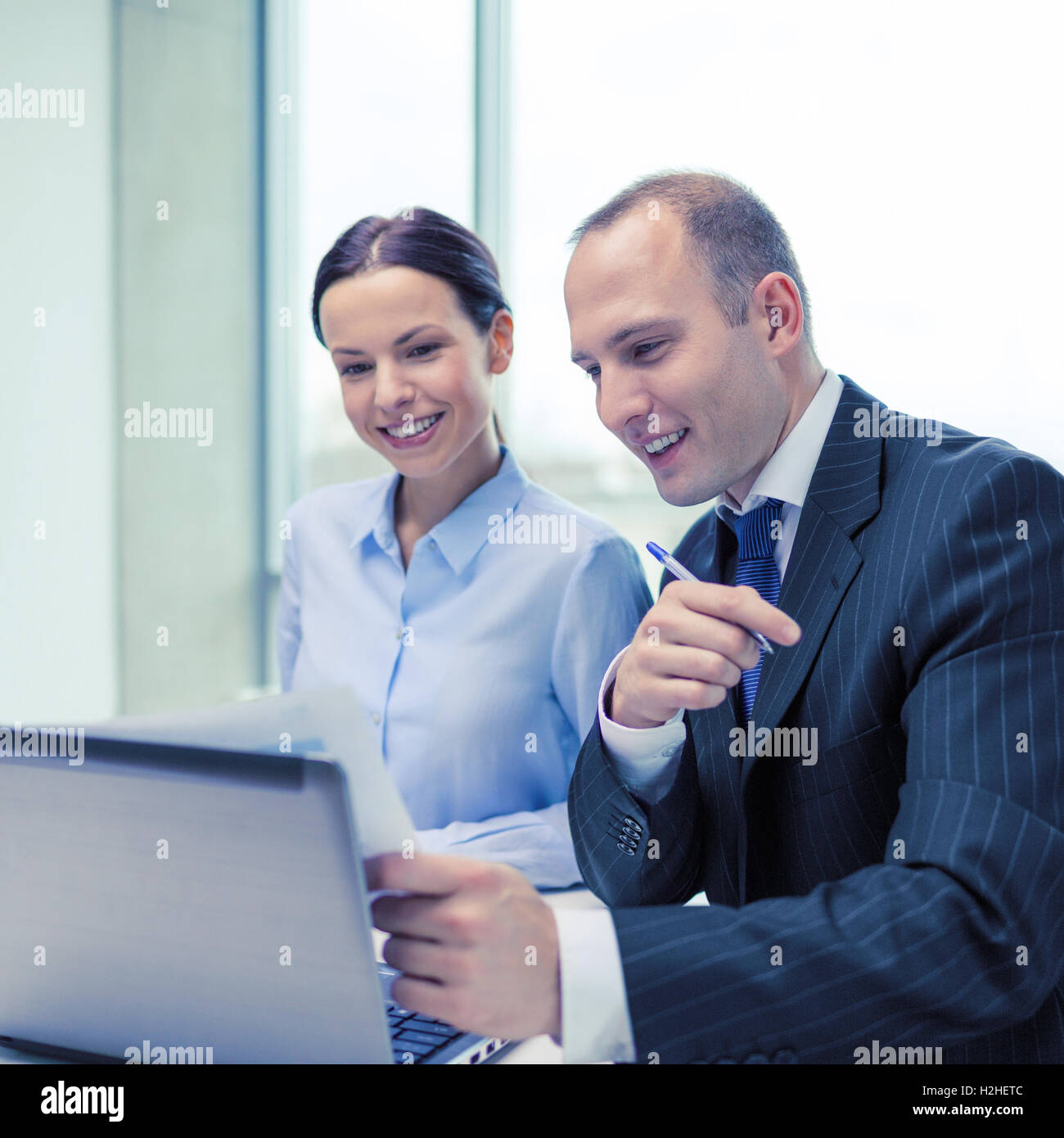 businessman and businesswoman having discussion Stock Photo - Alamy
