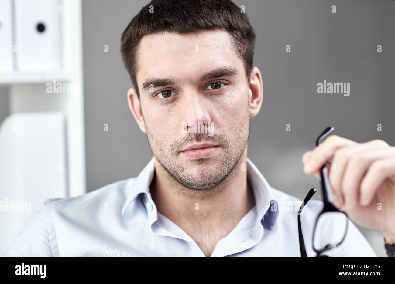 portrait of businessman with eyeglasses at office Stock Photo - Alamy