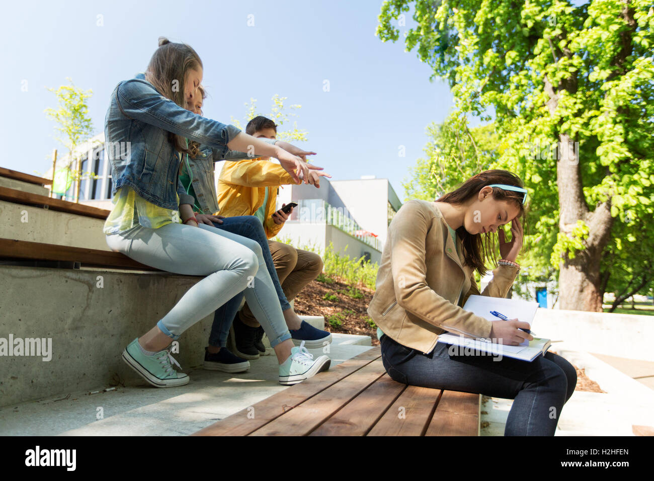 student girl suffering of classmates mockery Stock Photo - Alamy