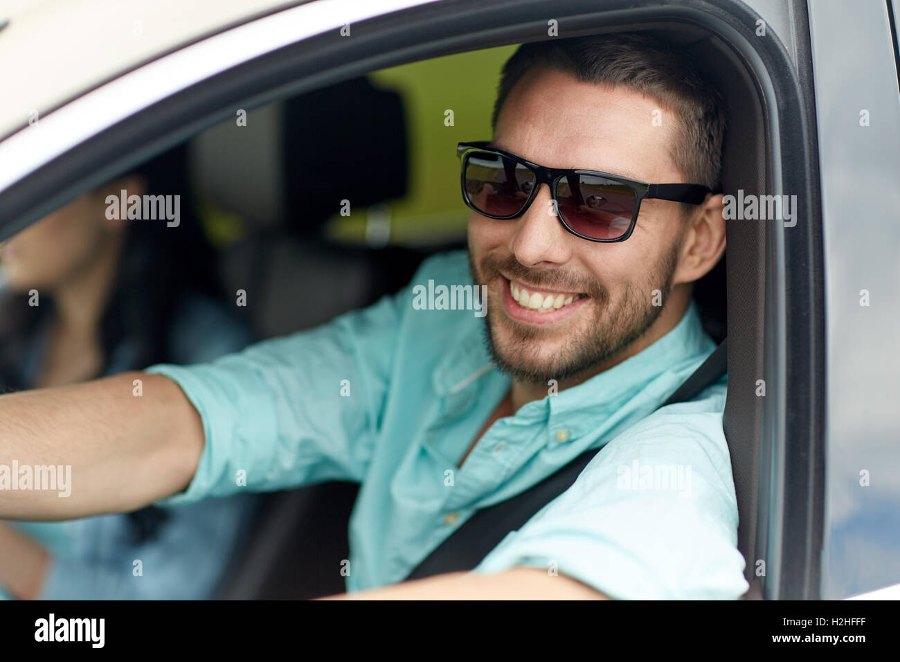 happy smiling man in sunglasses driving car Stock Photo - Alamy