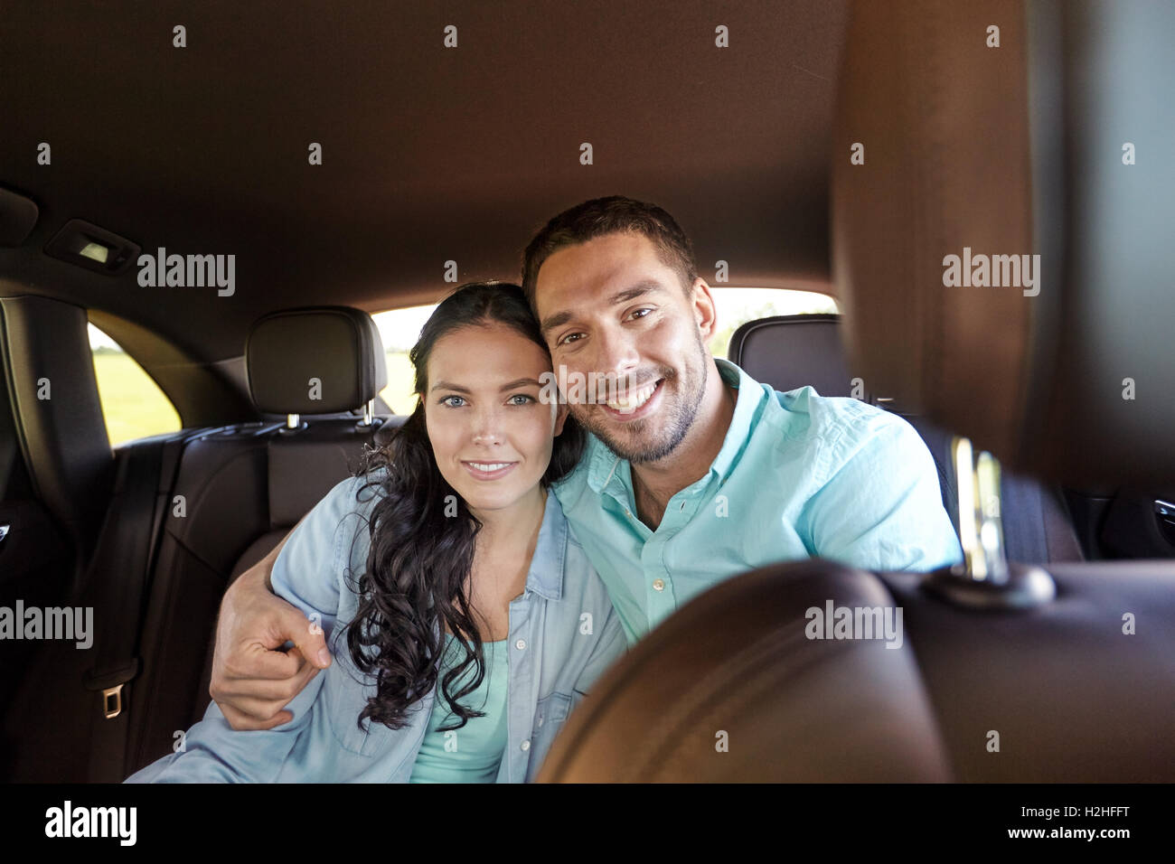 Couple hugging in back seat hi-res stock photography and images - Alamy