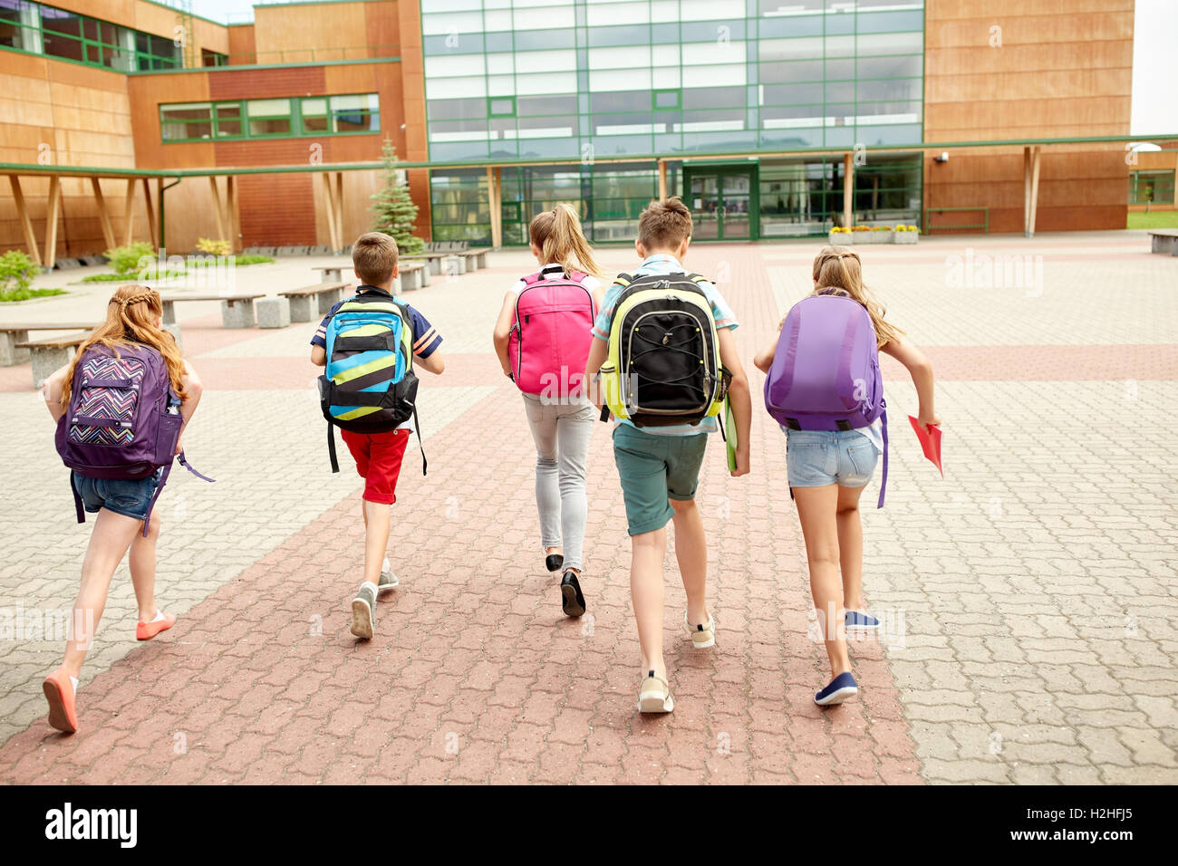 group of happy elementary school students running Stock Photo - Alamy