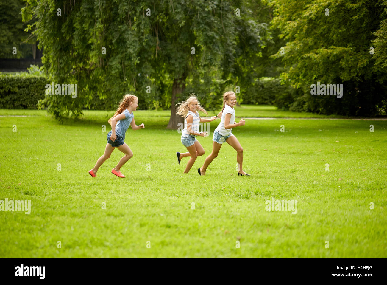 happy kids running and playing game outdoors Stock Photo - Alamy