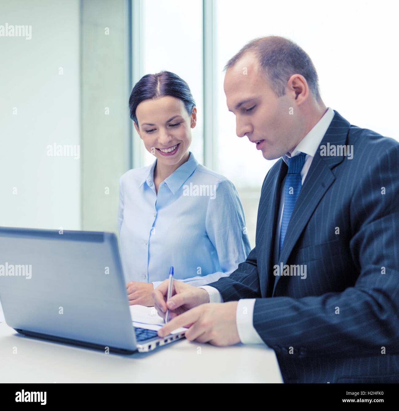 Two happy businesswomen discussing hi-res stock photography and images ...