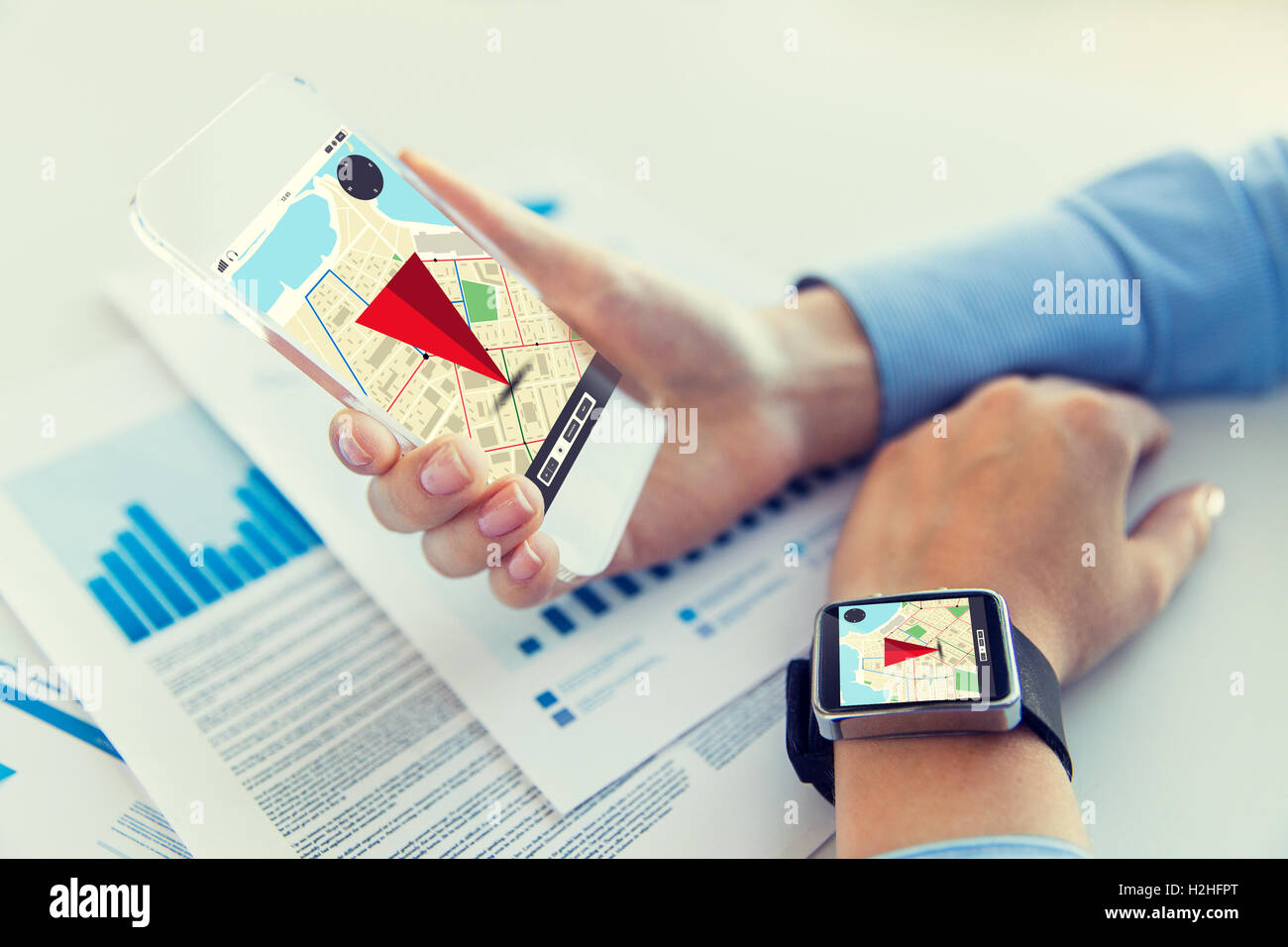 hands with navigator map on smart phone and watch Stock Photo - Alamy