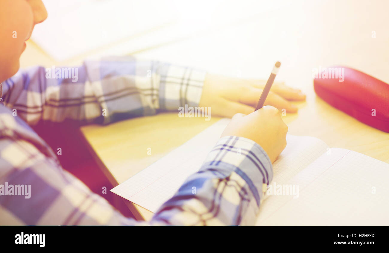 close up of schoolboy writing test at school Stock Photo - Alamy