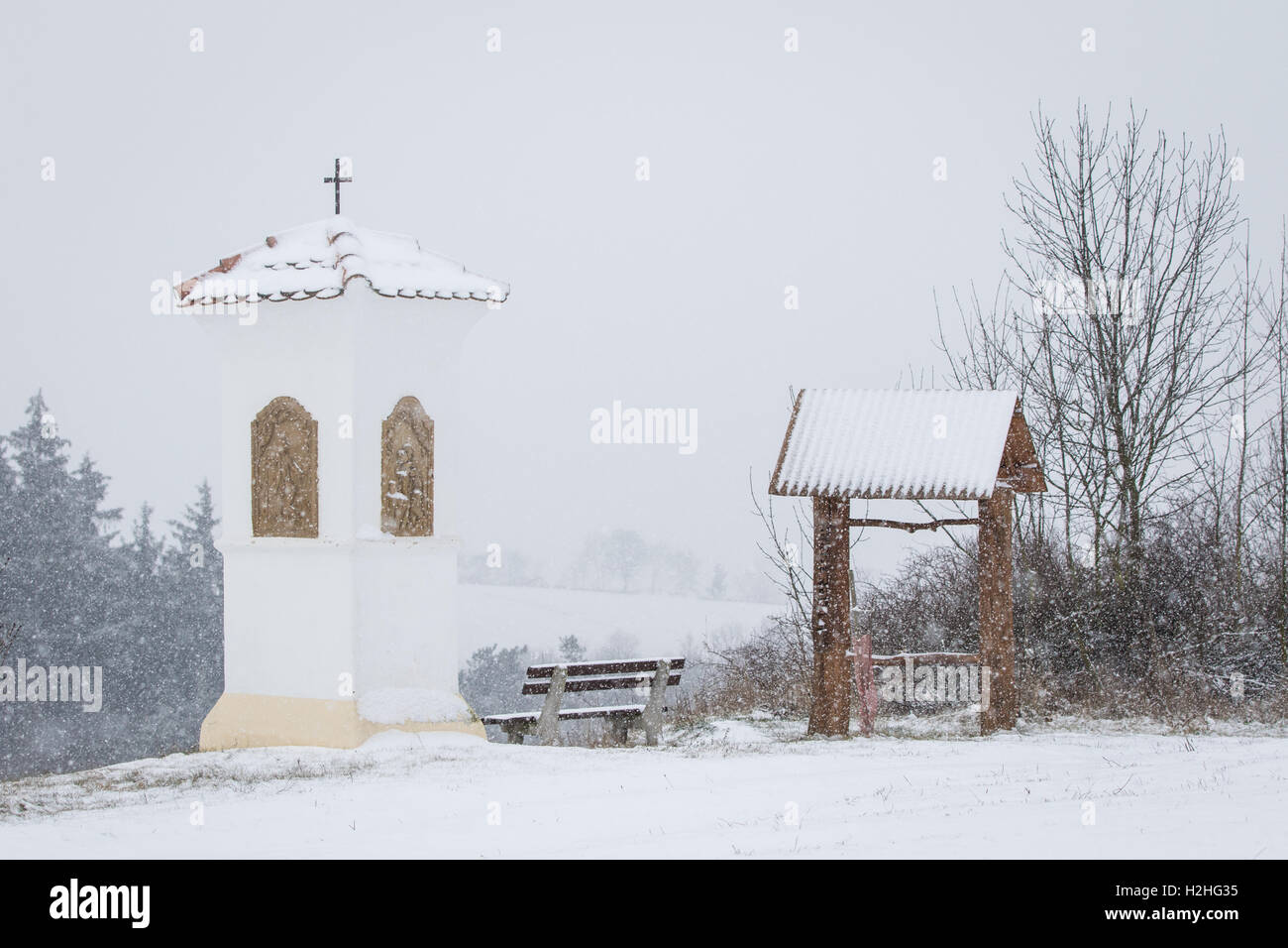 Snow falling on Religious Monument at pilgrimage place in the middle of ...